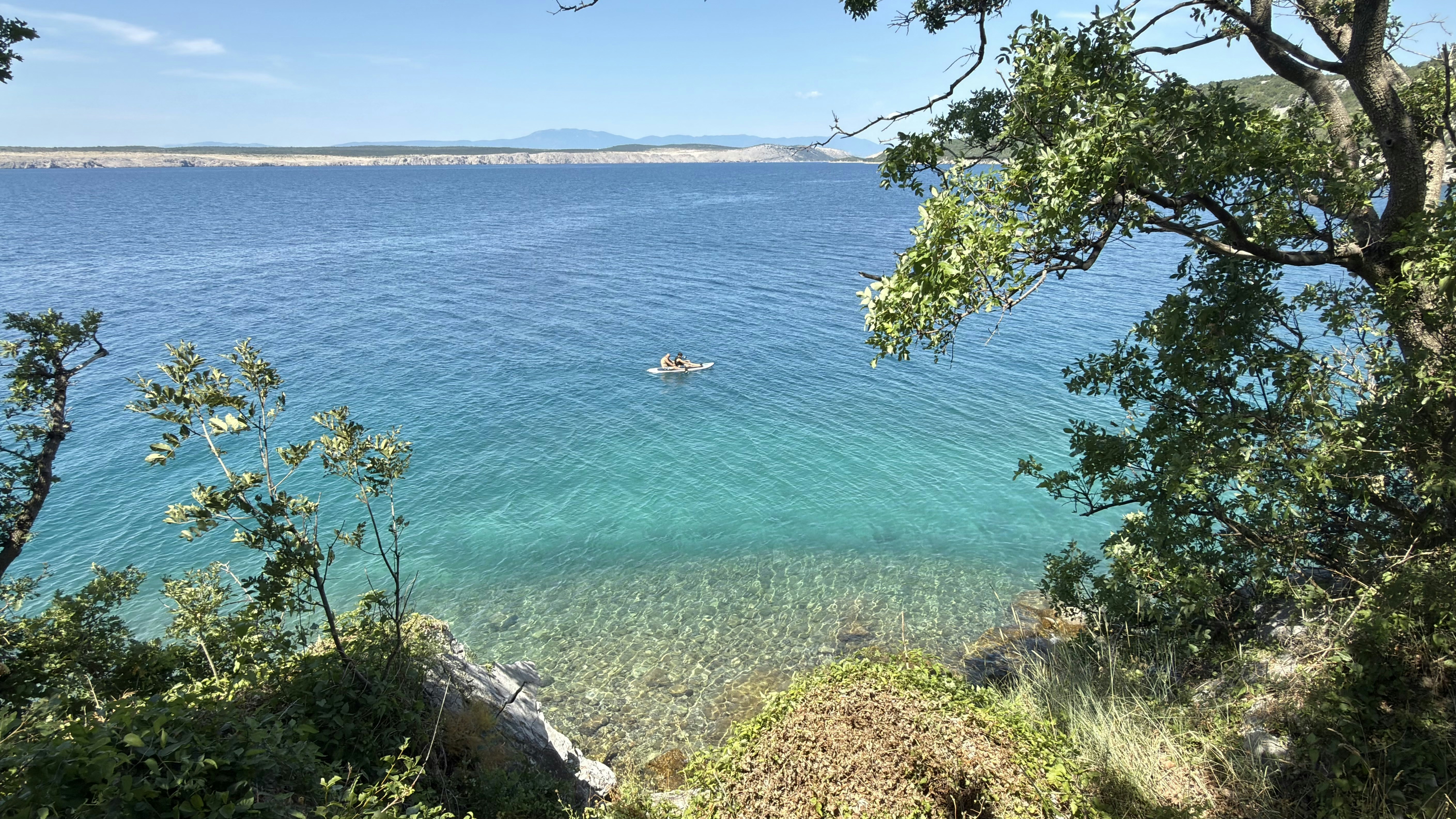 Azure Cove: A Rocky Terrace Over The Quiet Sea
