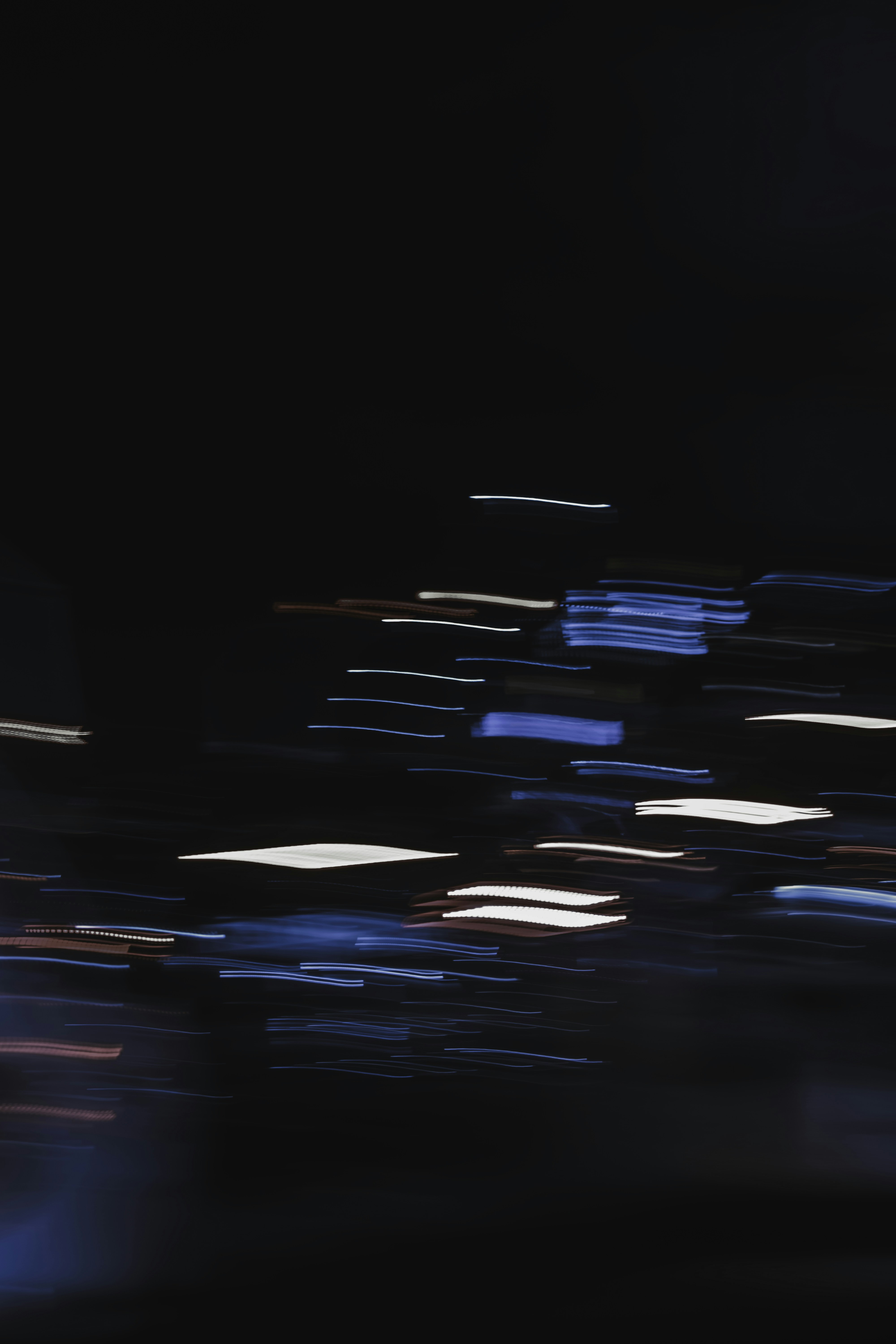 Night motion blur over a cityscape stitched in light