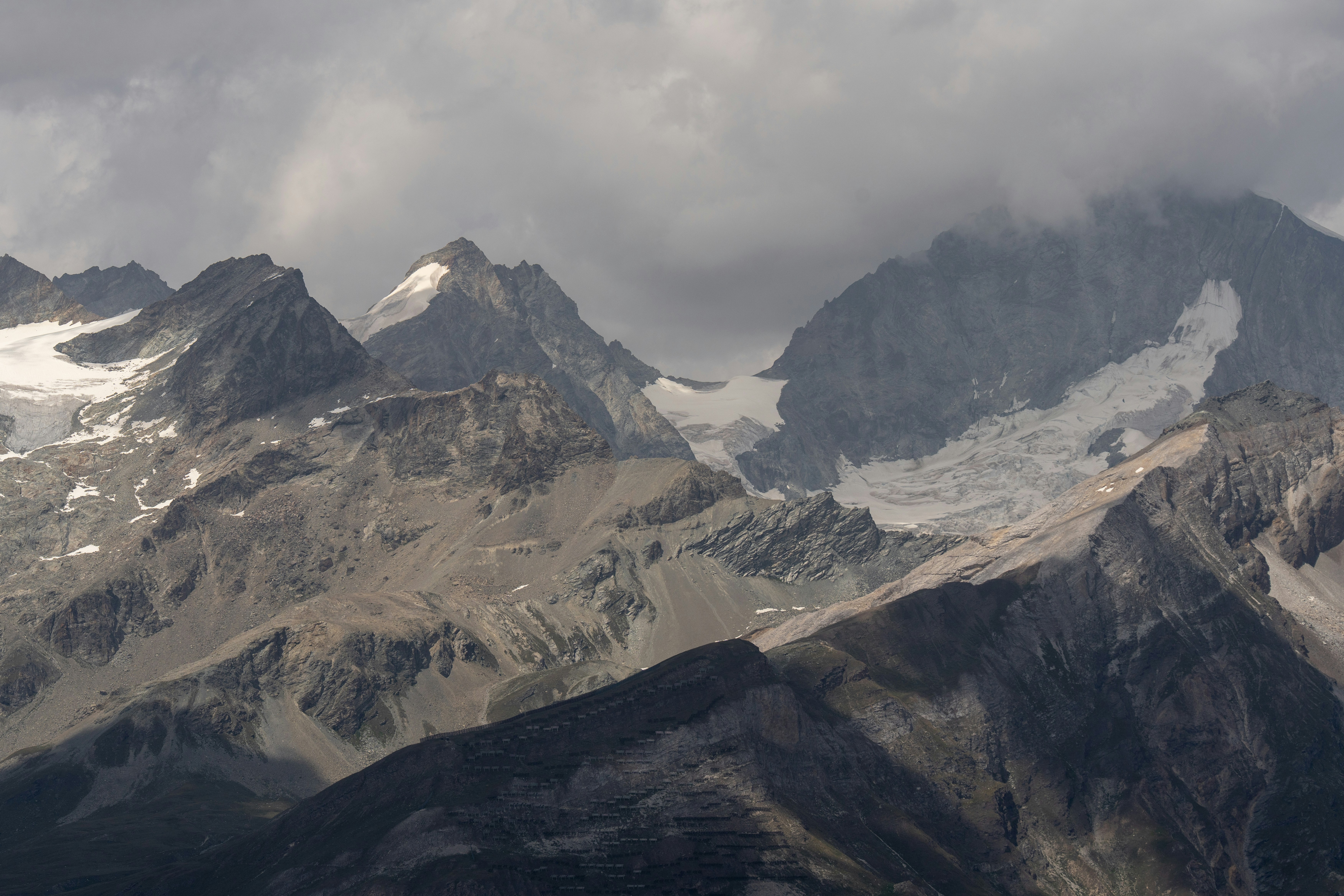 Snow-kissed Ridges under a Shaded Crest