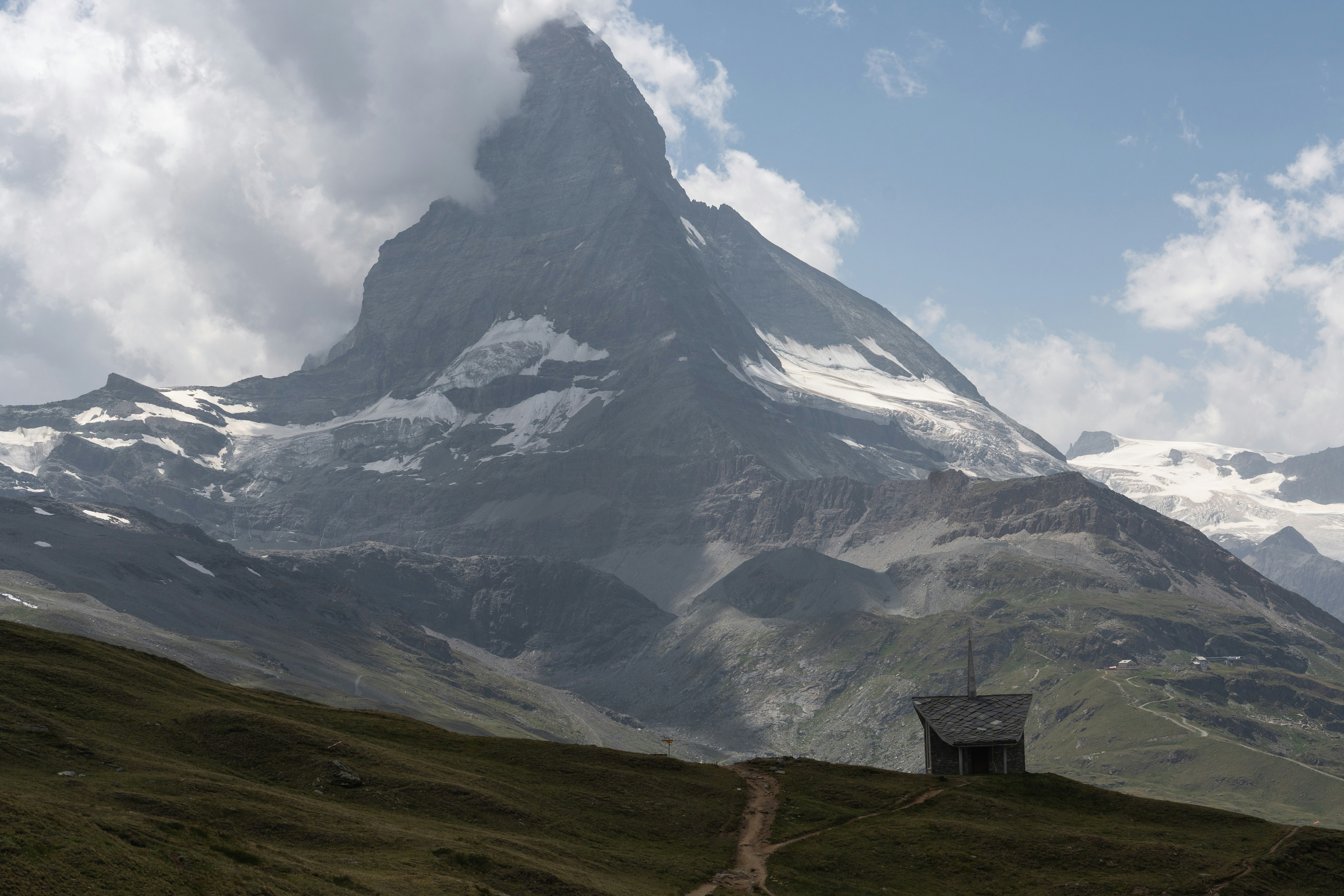 Snow-etched Peak Over a Lonely Mountain Hut