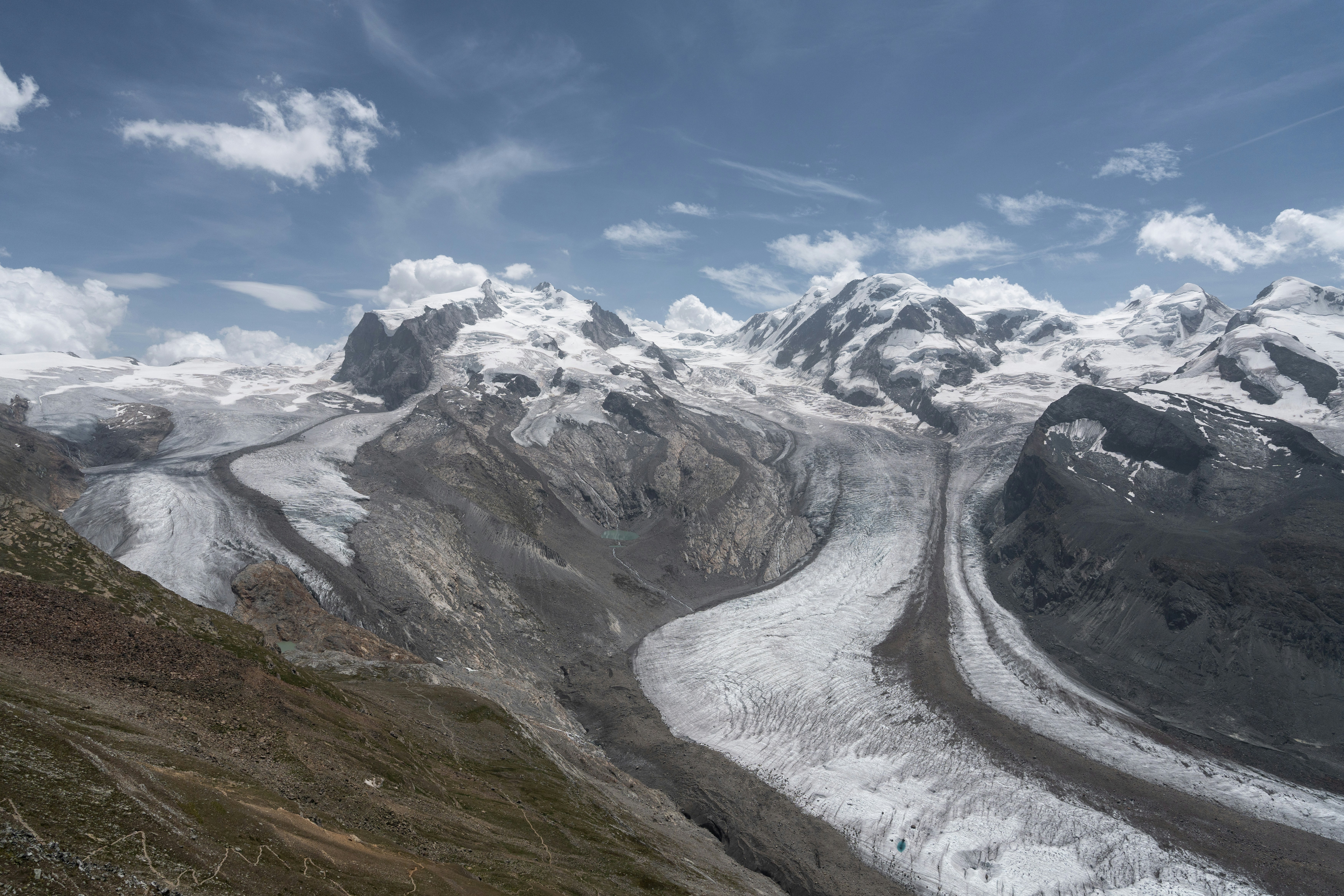 Glacial Undertow: A Snowfield Carved by Mountaintop Rivers