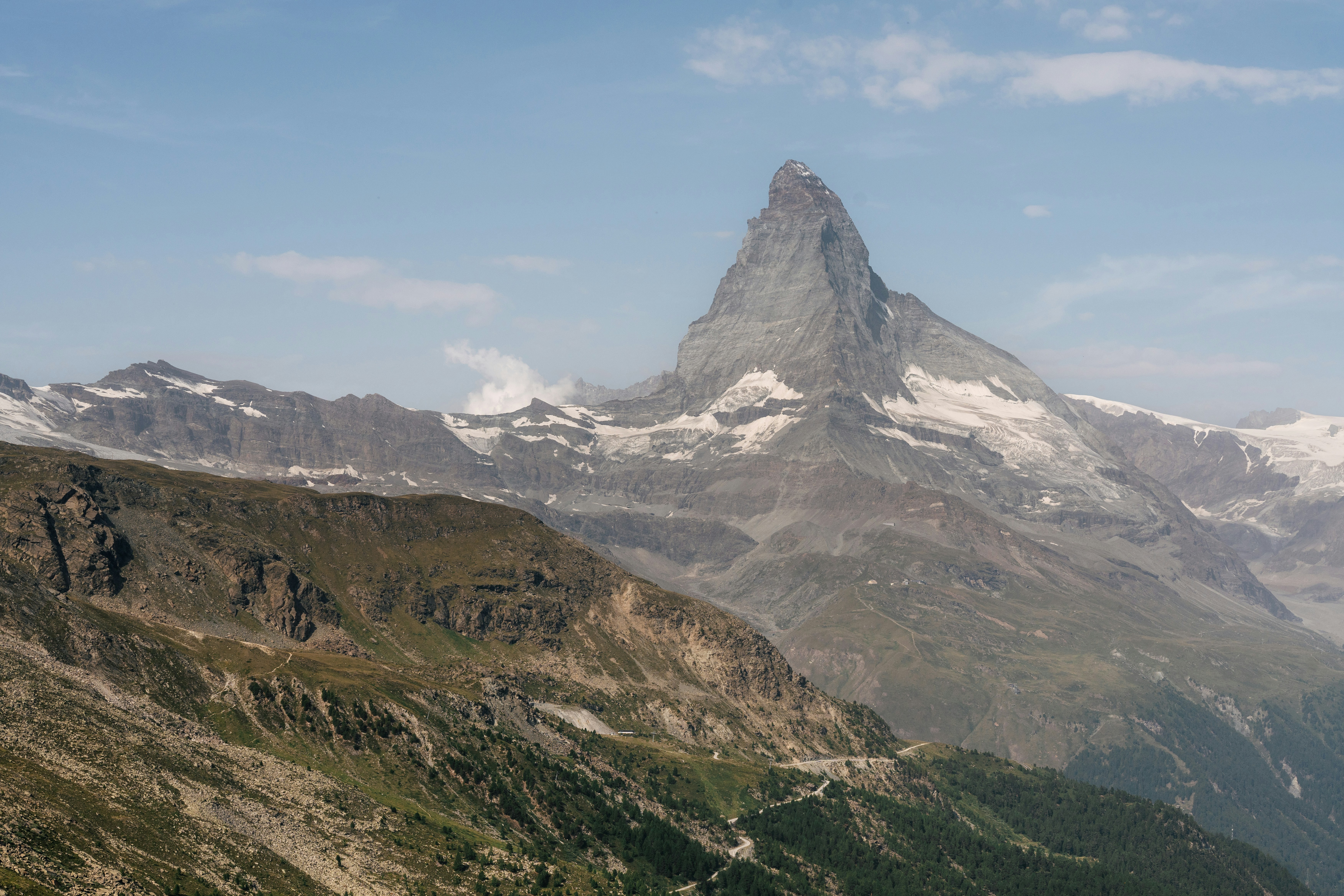 The Needle Rises: A Summit Crowned by Alpine Light