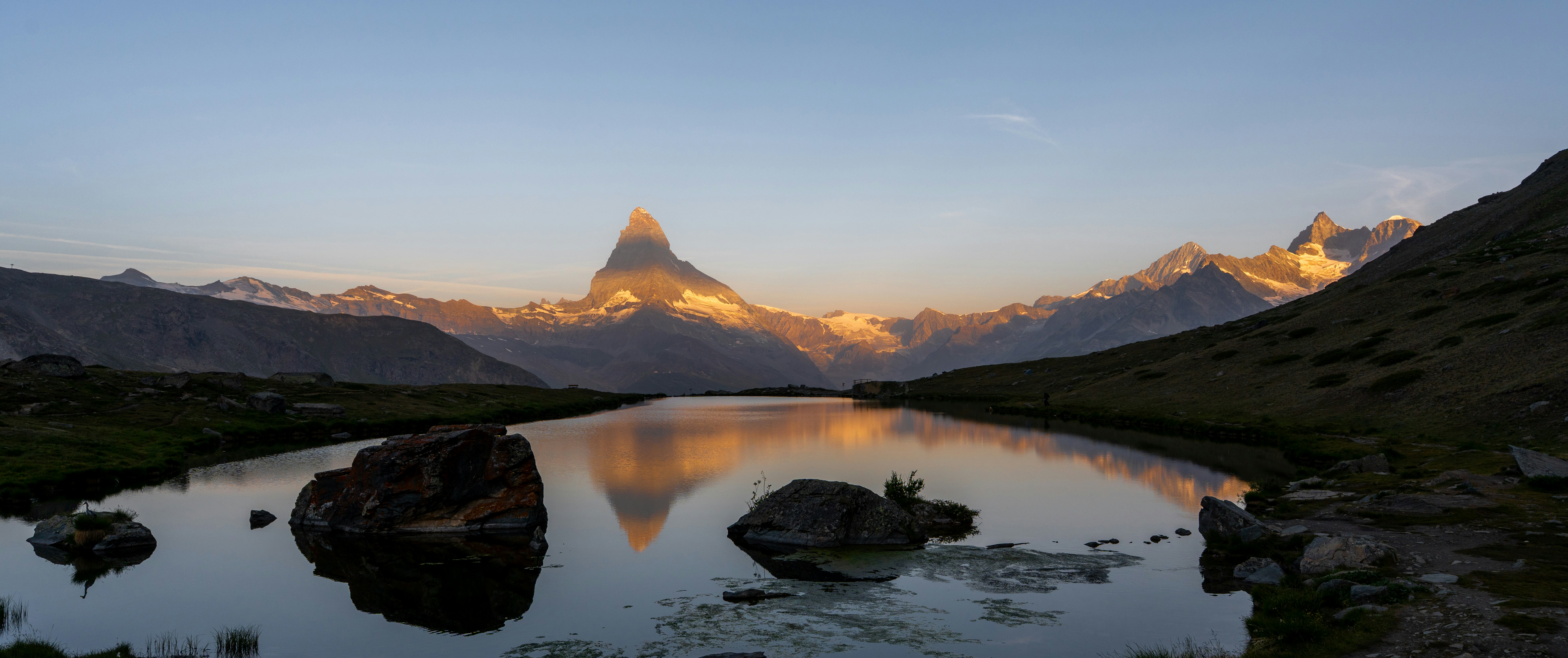 Twin Peaks of Light: Alpine Needle Reflected