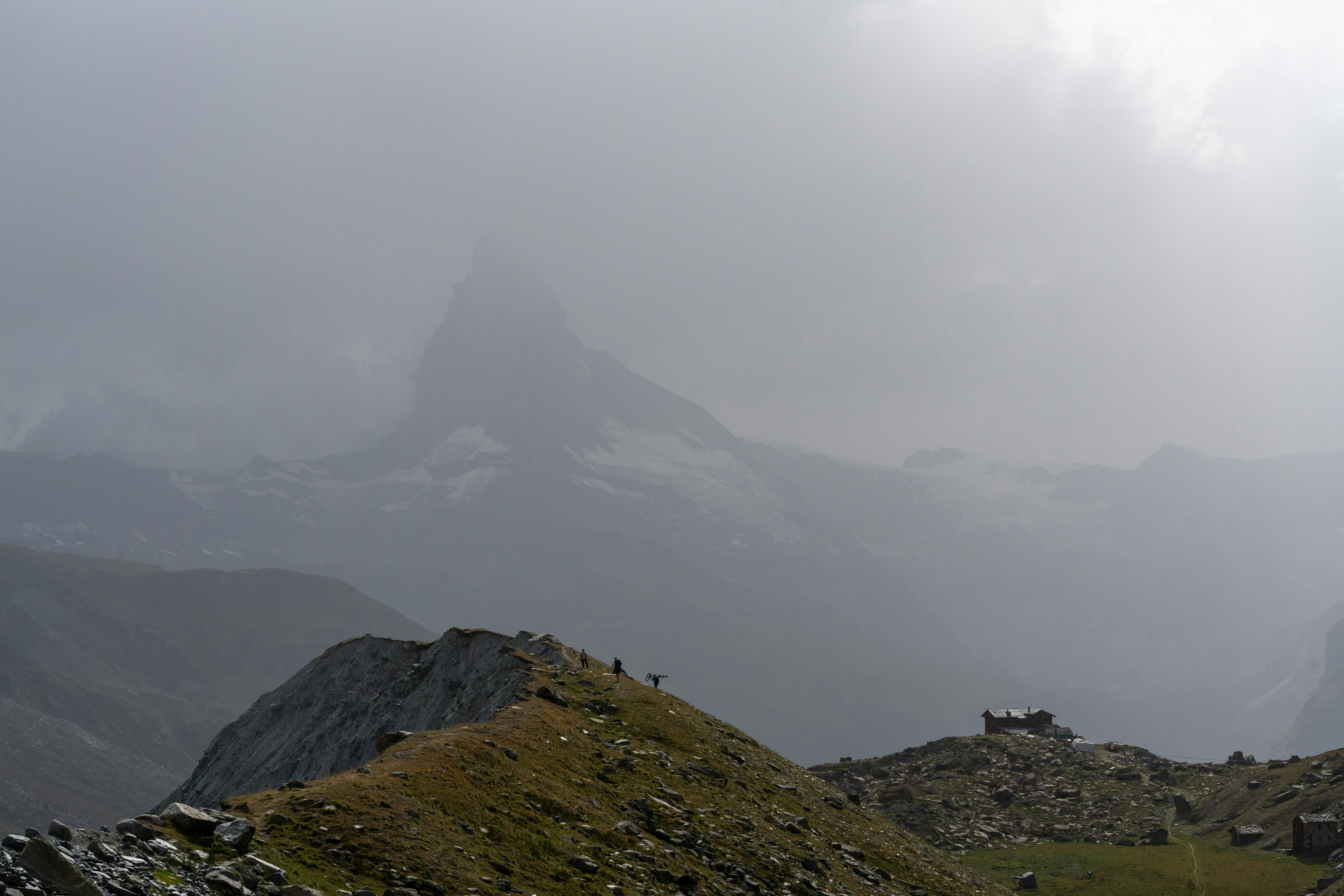 Mist-wrapped Summit: A Ridge Leading to a Distant Peak