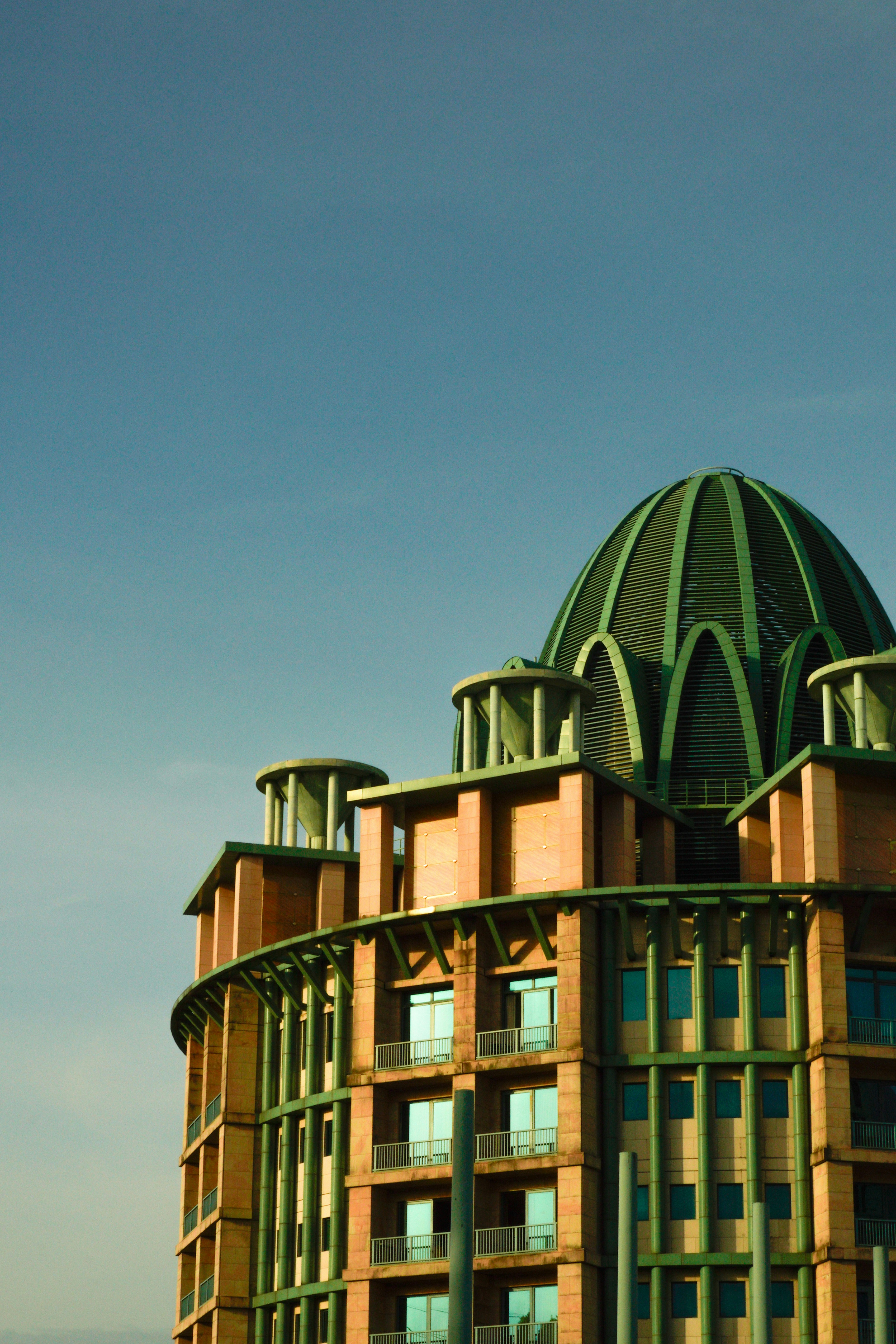 Green Dome Rising: A Brick Facade and Towering Green Roof