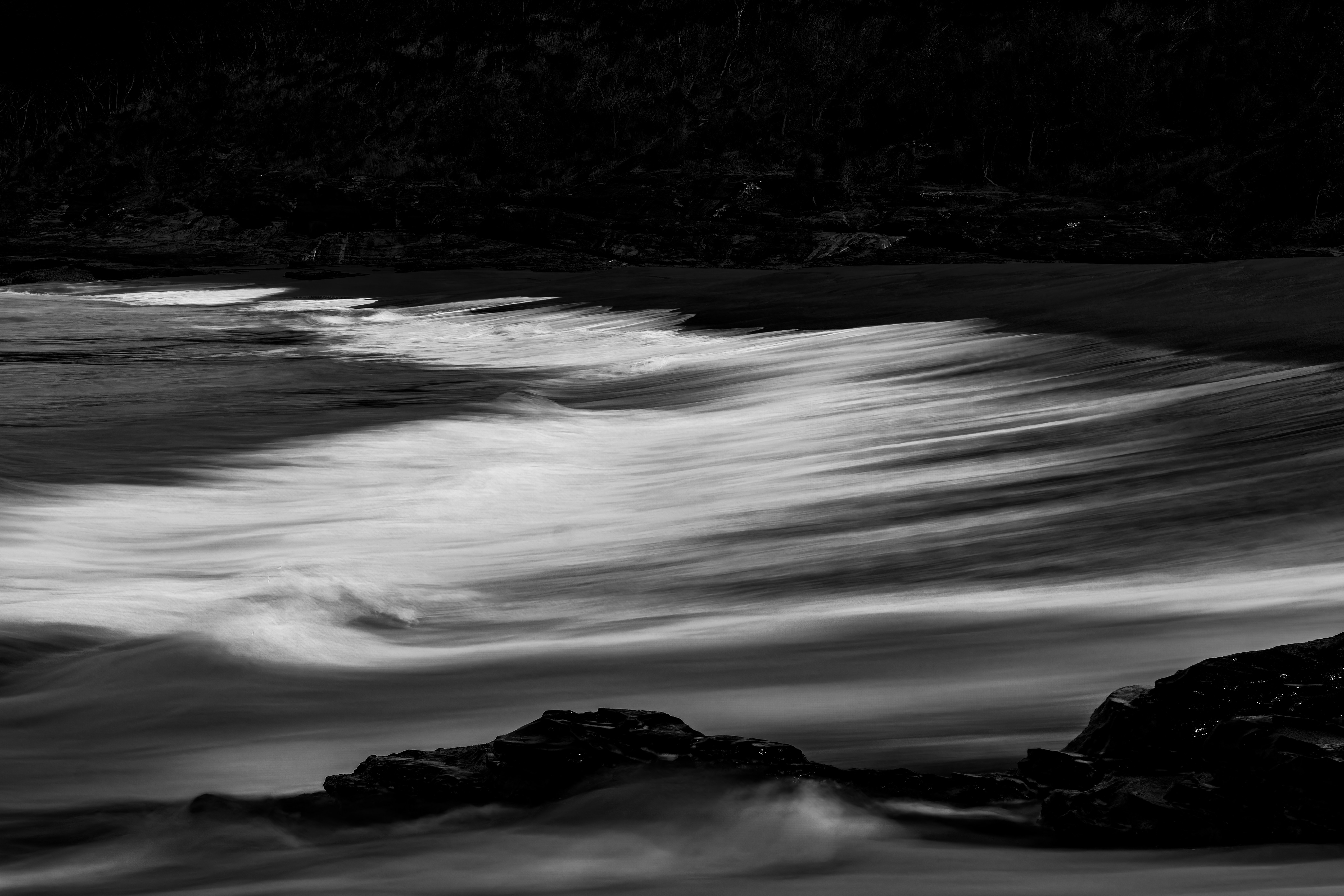 Moonlit Tide: A Silhouette Over a Quiet Shore