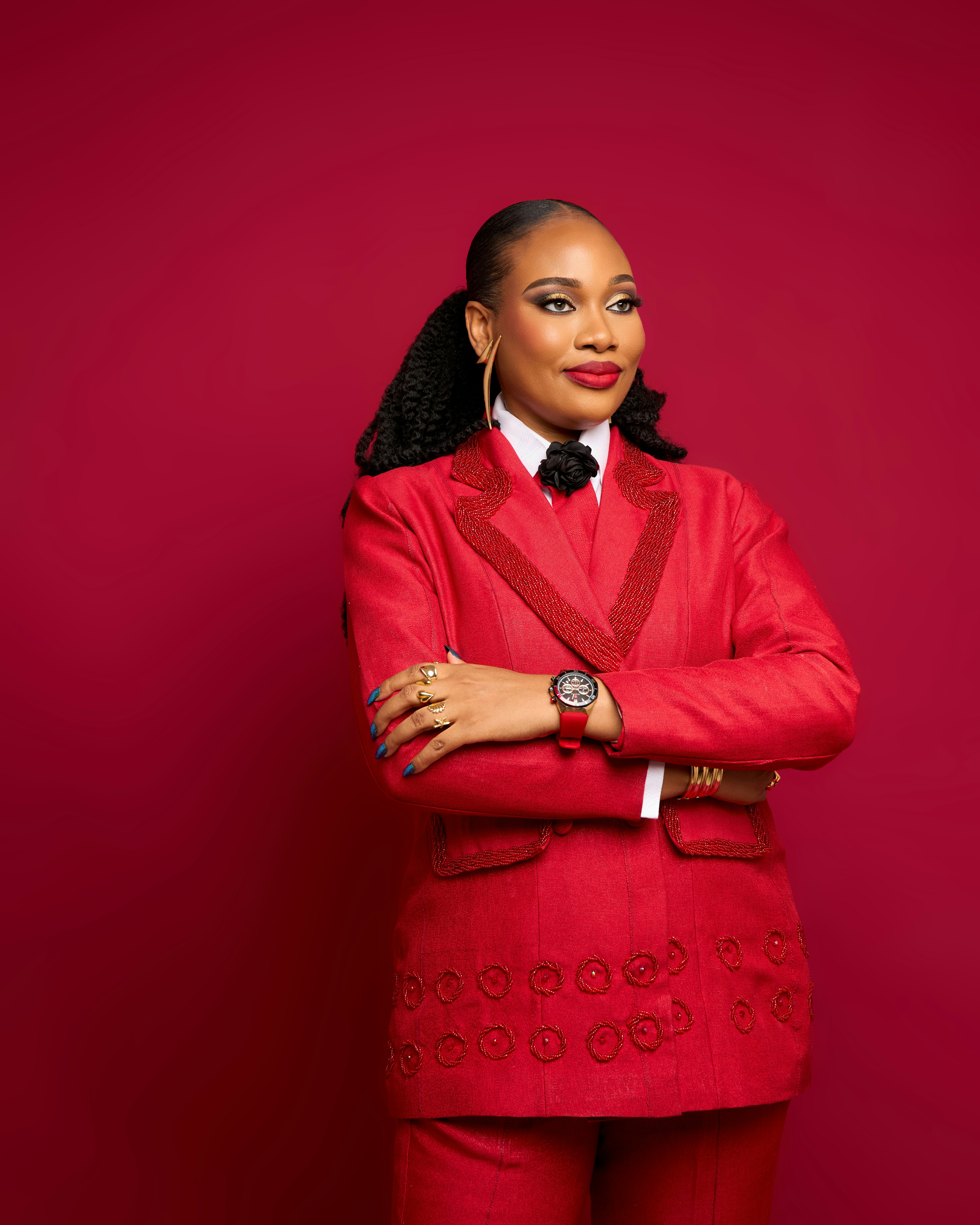 Power Suit: A Confident Red Ensemble on a Bold Crimson Backdrop