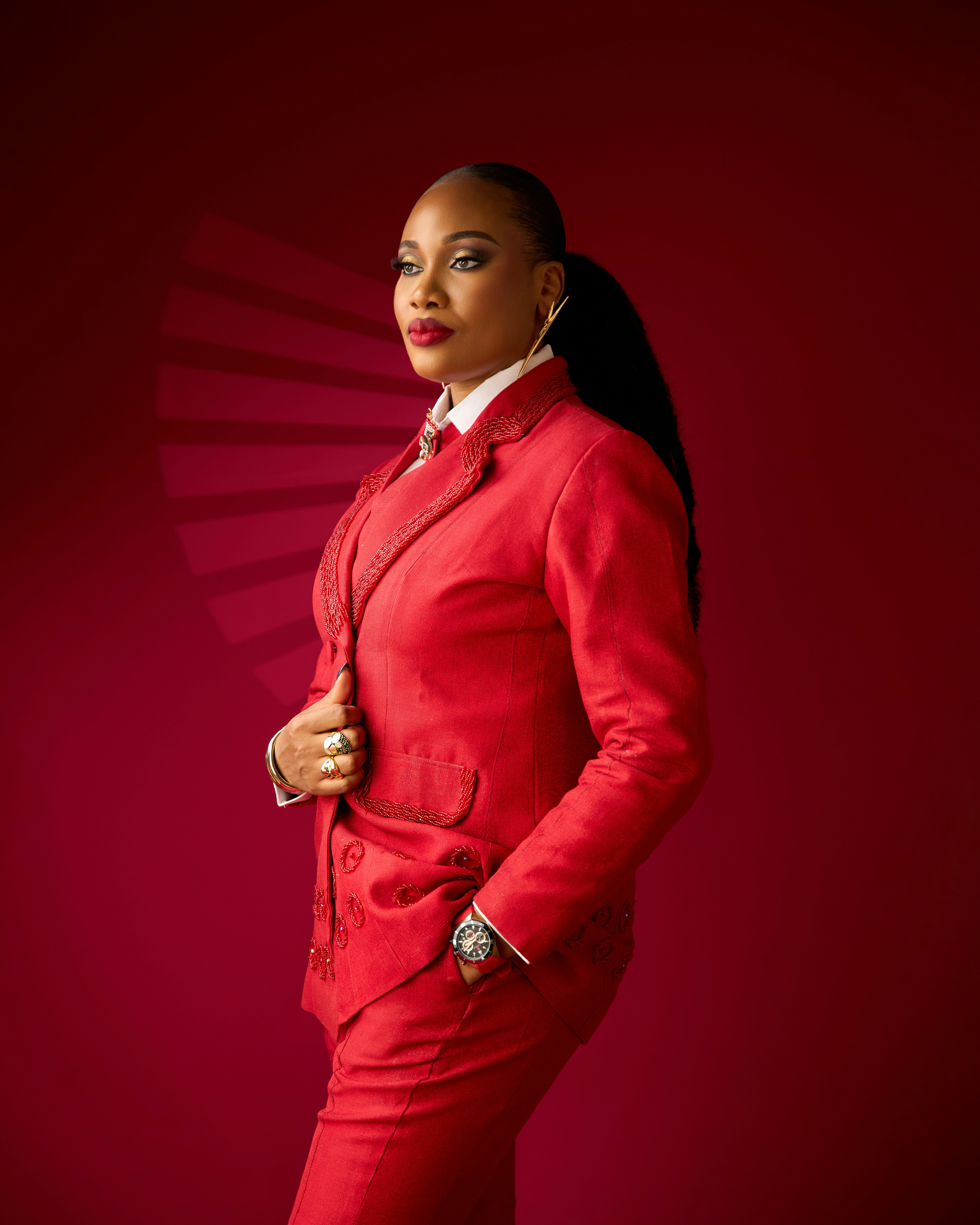 Crimson Velvet: A poised executive under gallery-red glow