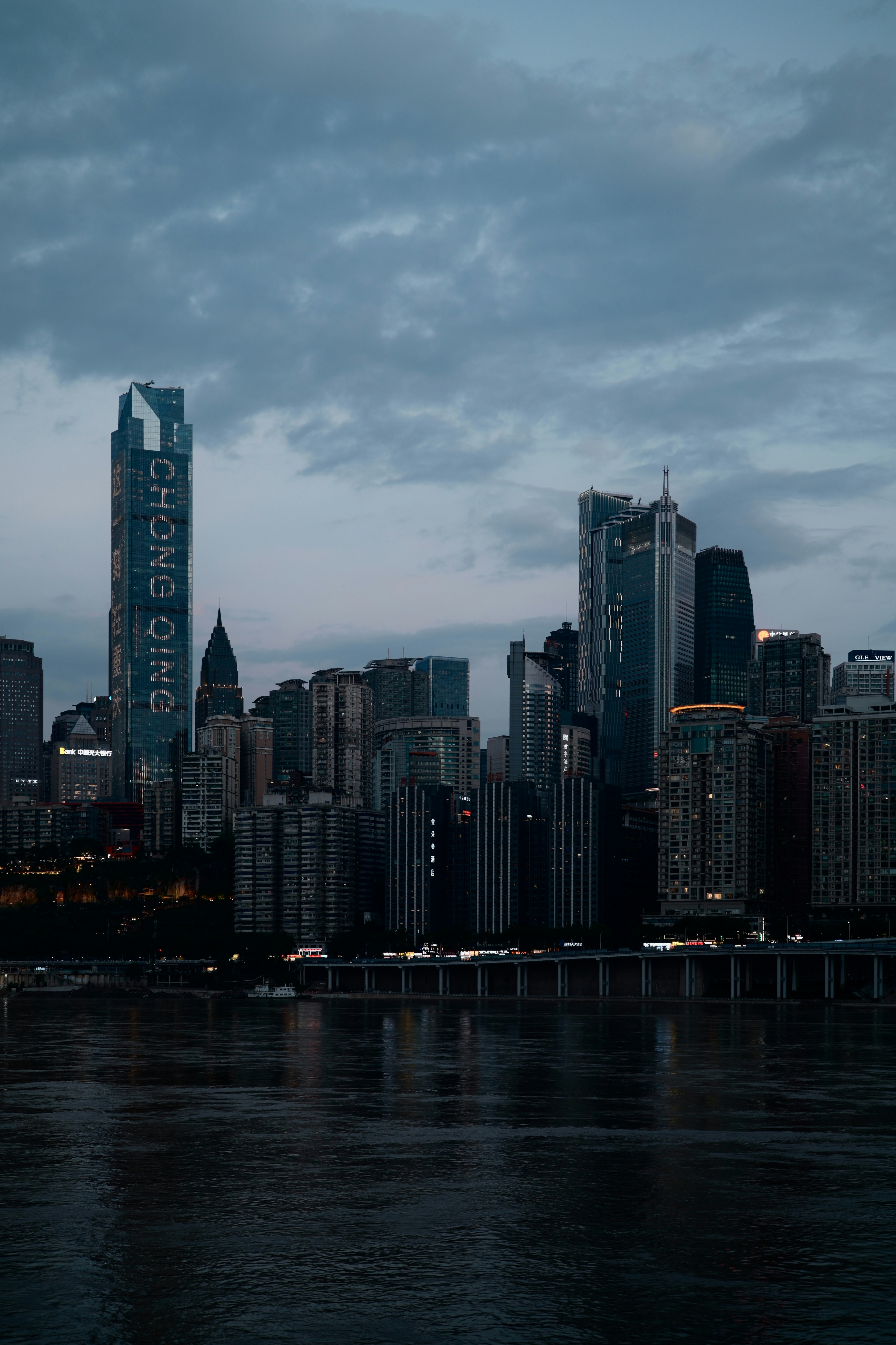 Chill City Skyline: Nightfall Reflections Over a Quiet River