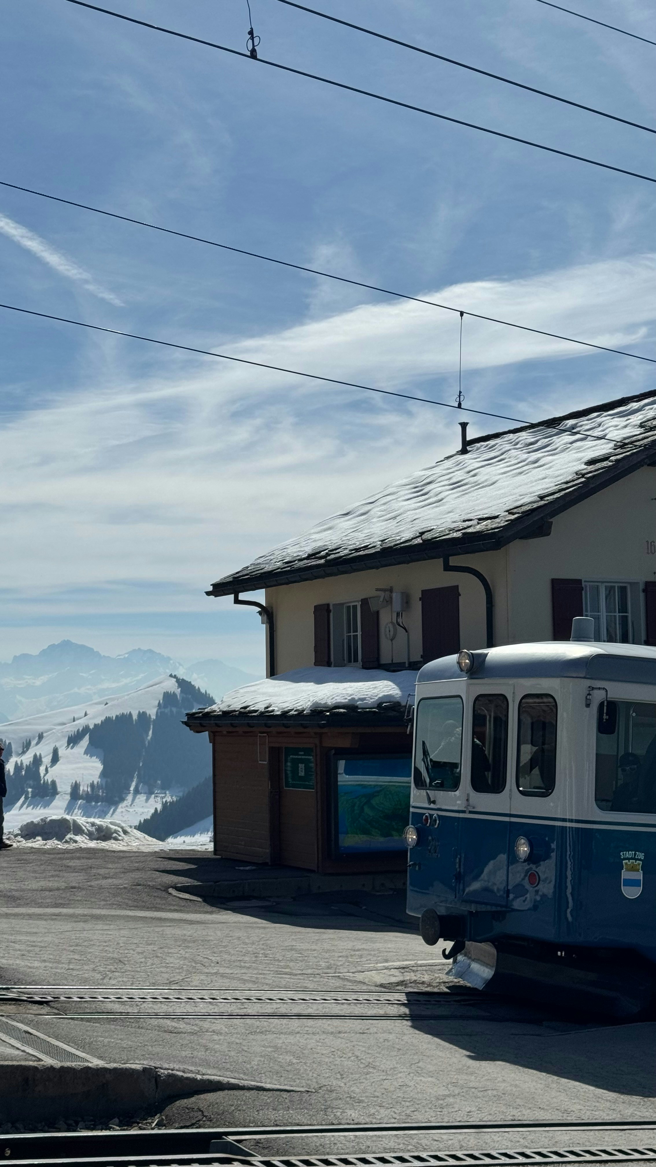 Snowbound Summit Station with a Blue Tram
