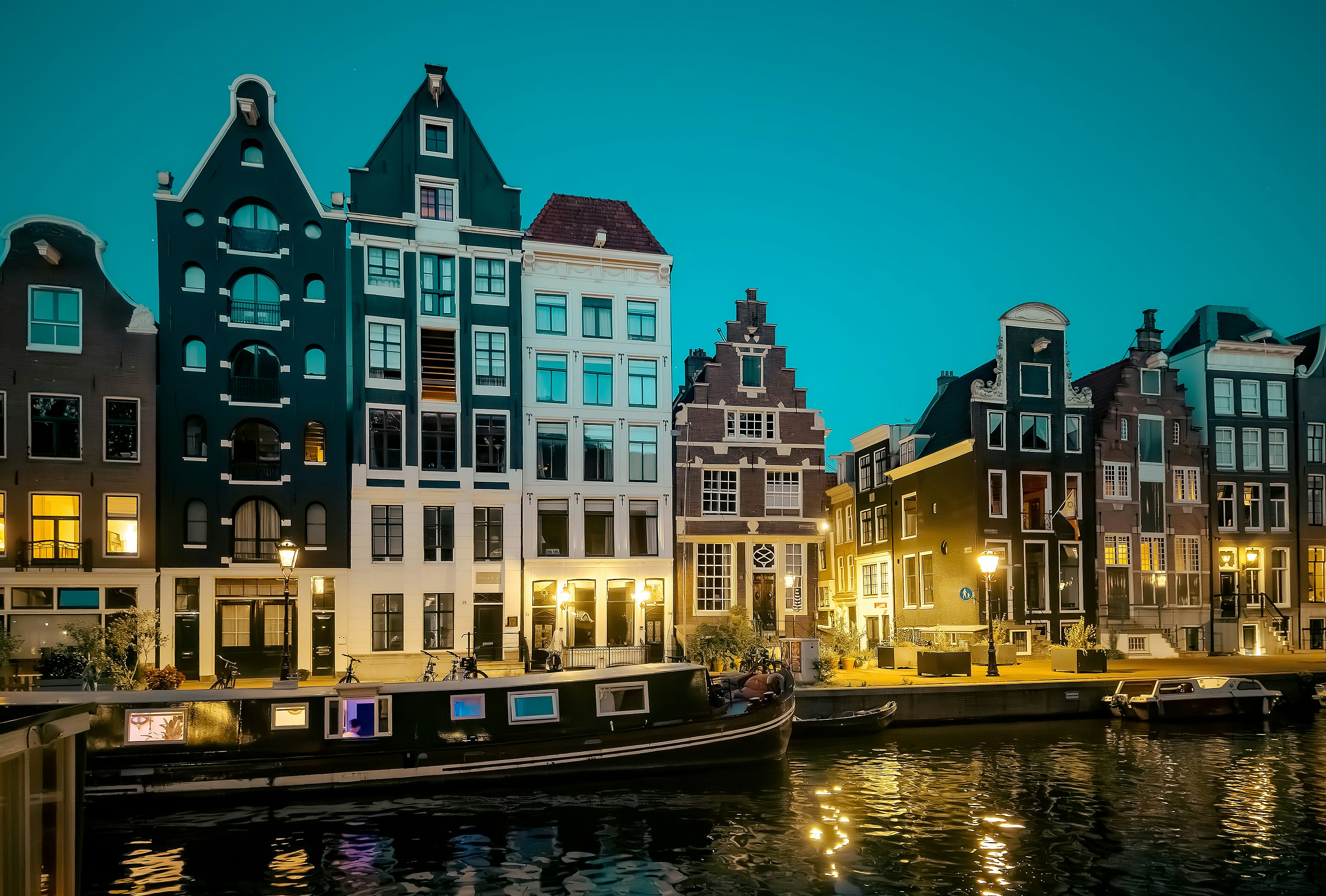 Evening Canal Row: Dutch Facades Glow Along the Water