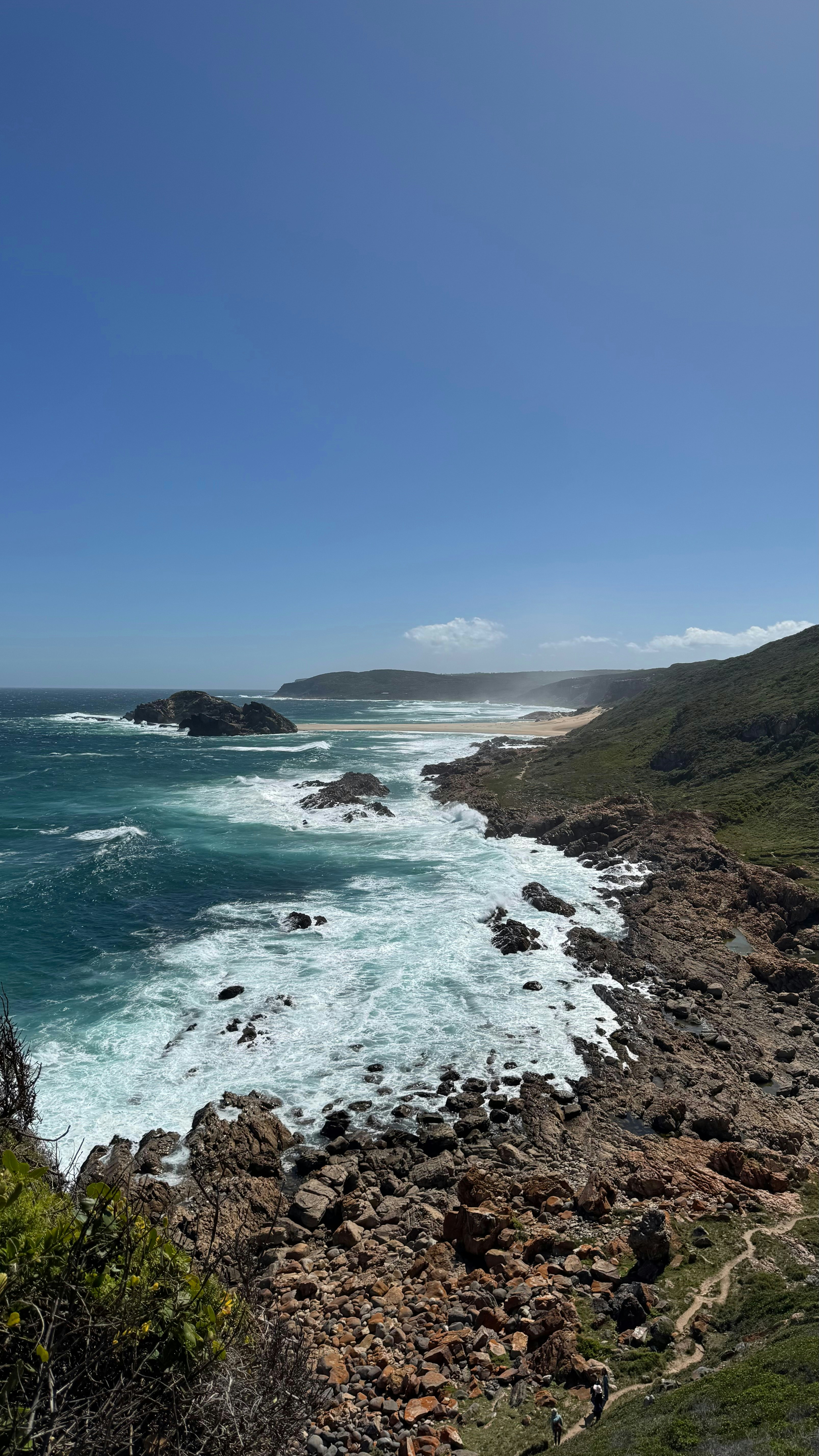 Cobalt Coastline: Cliffside Path Cascades into the Sea