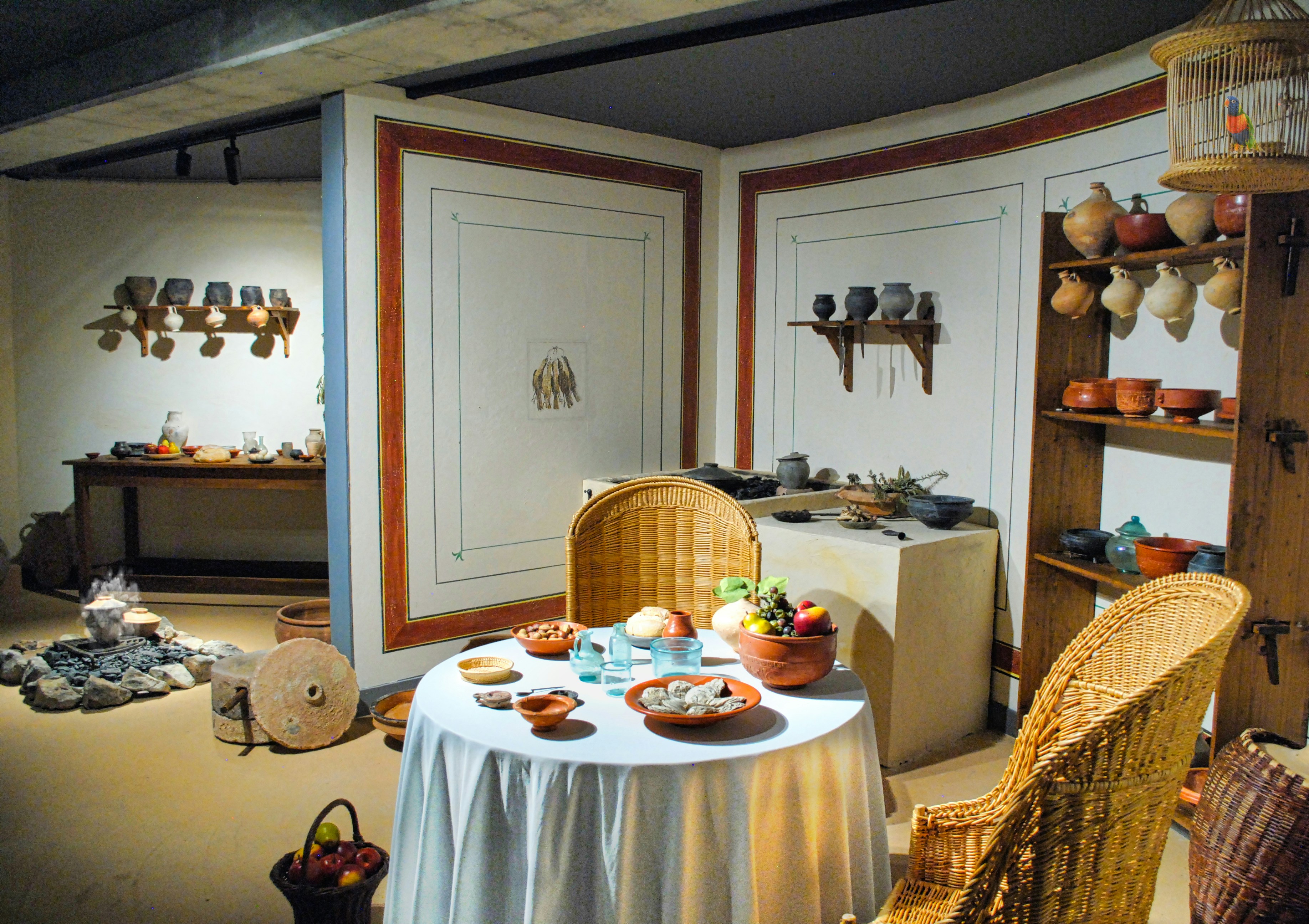 Table Treasures in a Quiet Gallery: A Still Life Within a Woven-Walled Room