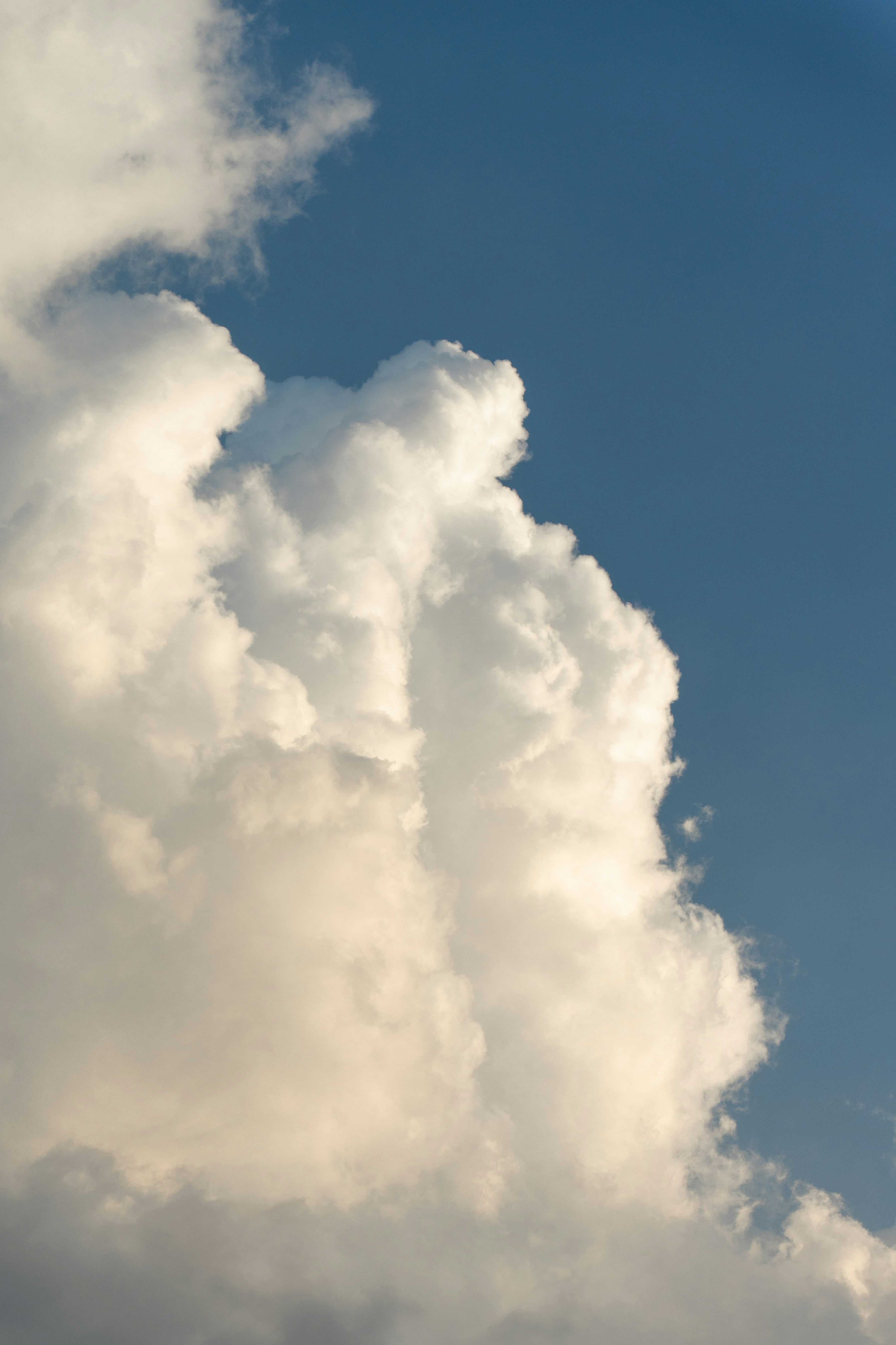 Towering Cloud Pinnacle in a Clear Blue Sky