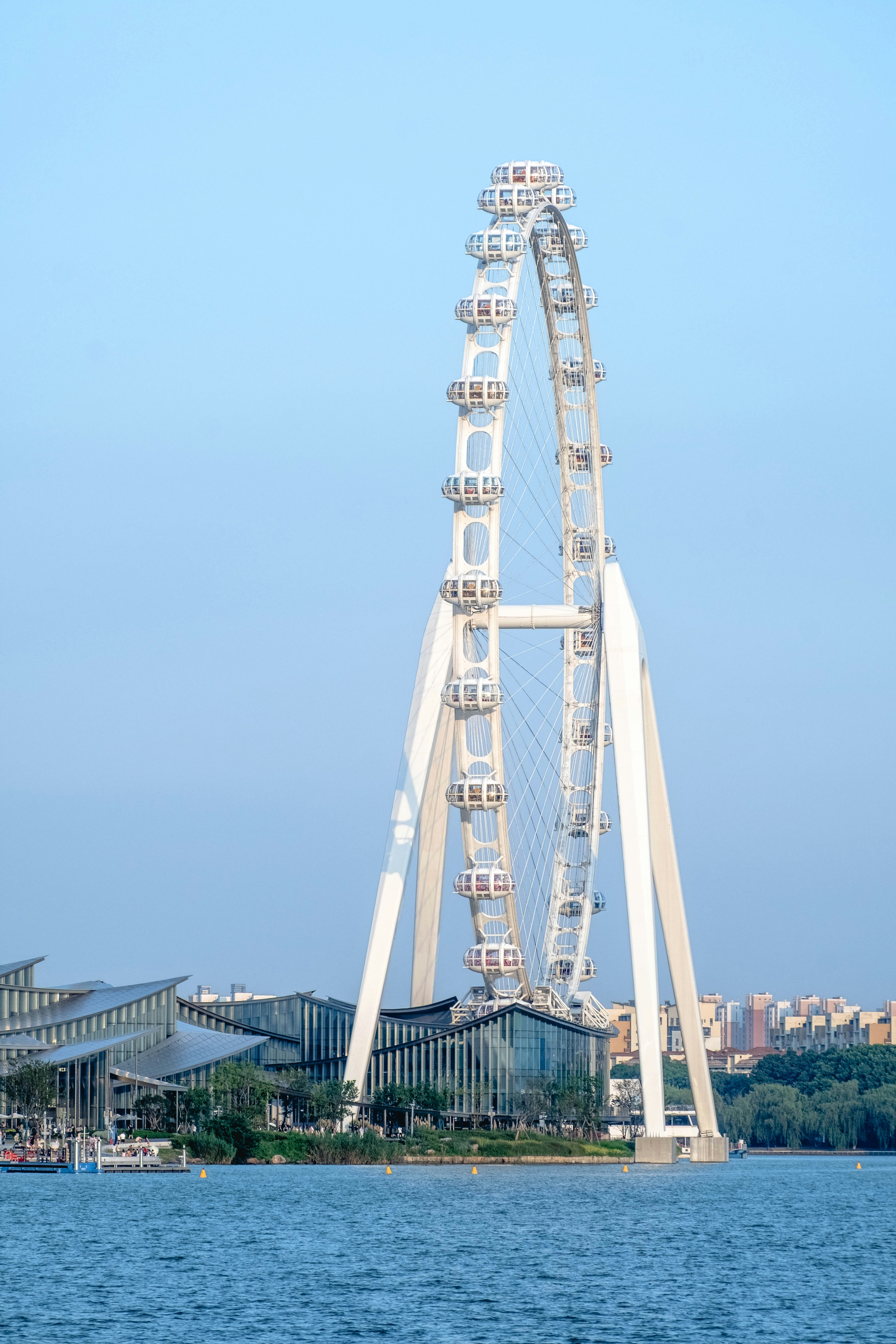 London Eye over calm harbor: a crisp morning skyline