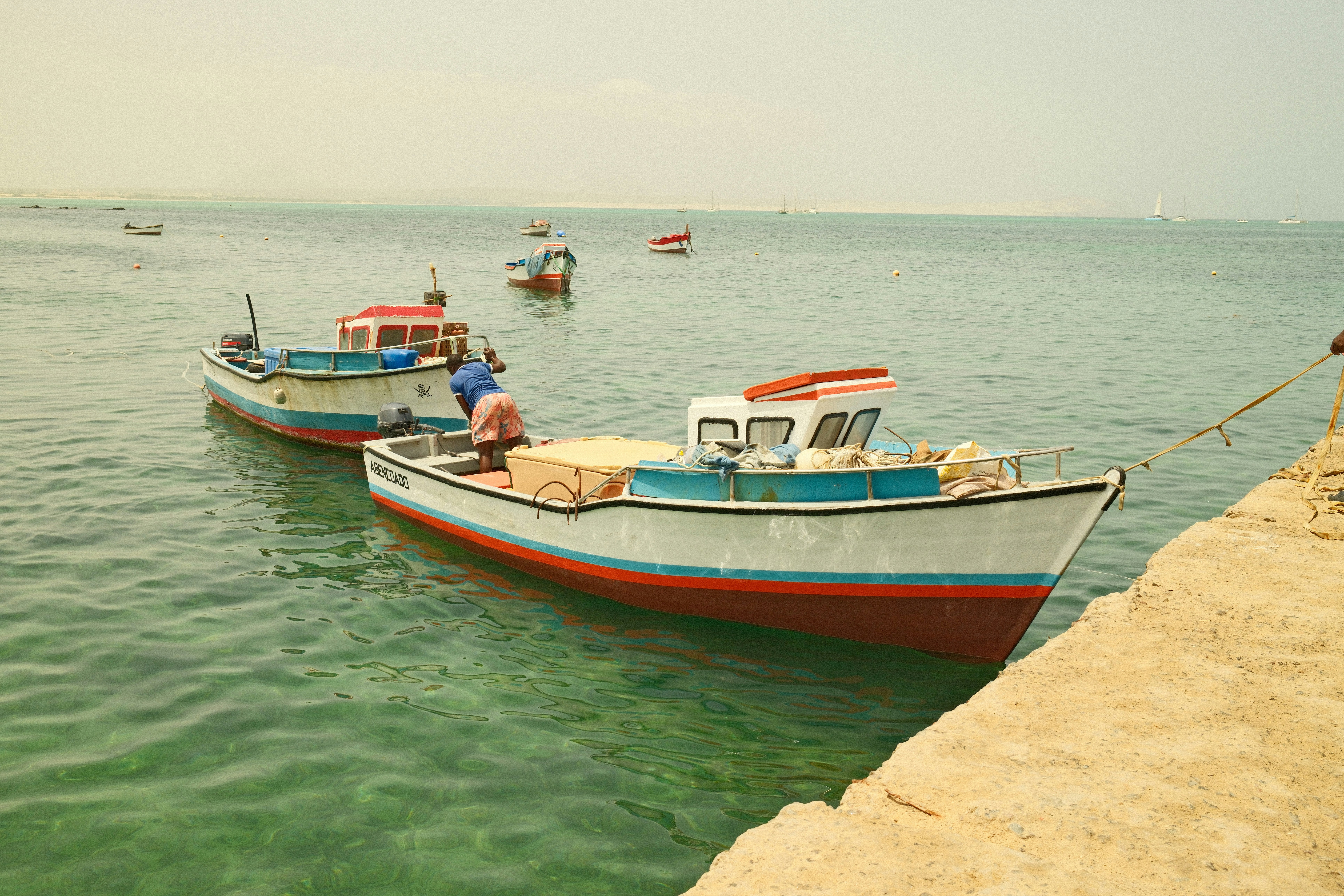 Anchors at Dawn: Boats Quietly Rest by a Quiet Pier