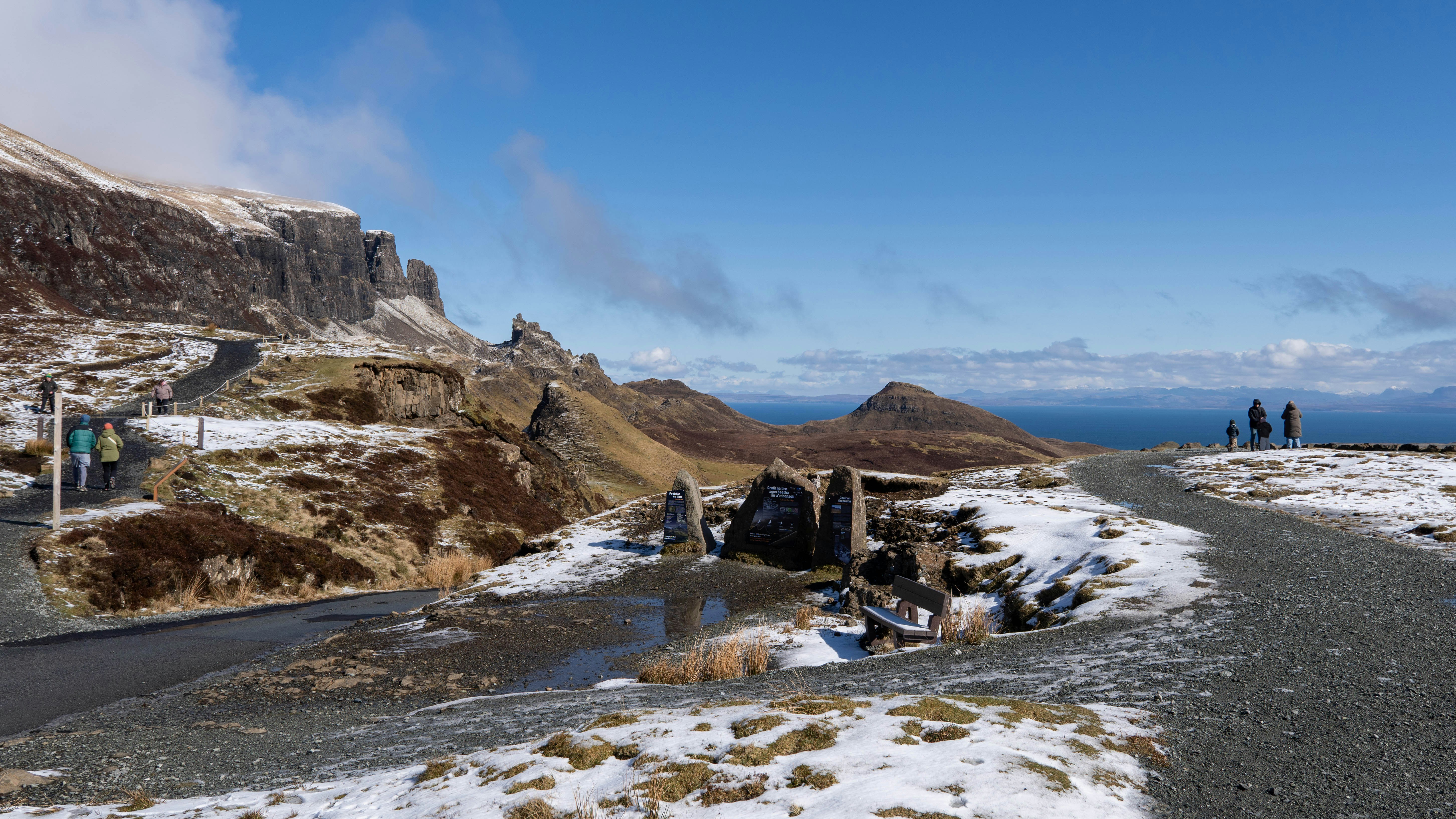 Coastal Edge: Snow-dusted Trail Toward a Distant Horizon