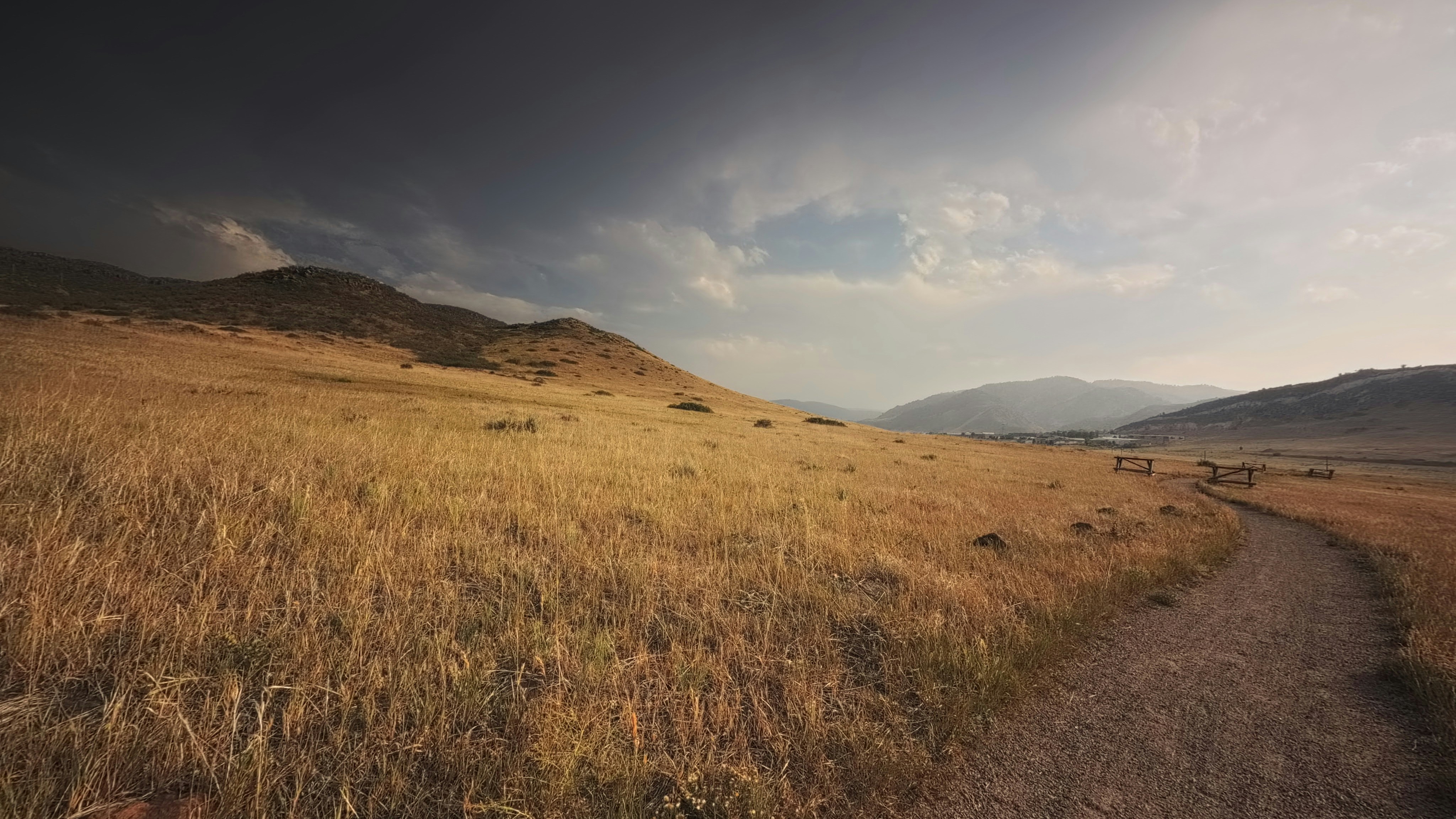 Golden Grass Trail Under a Dramatic Skies