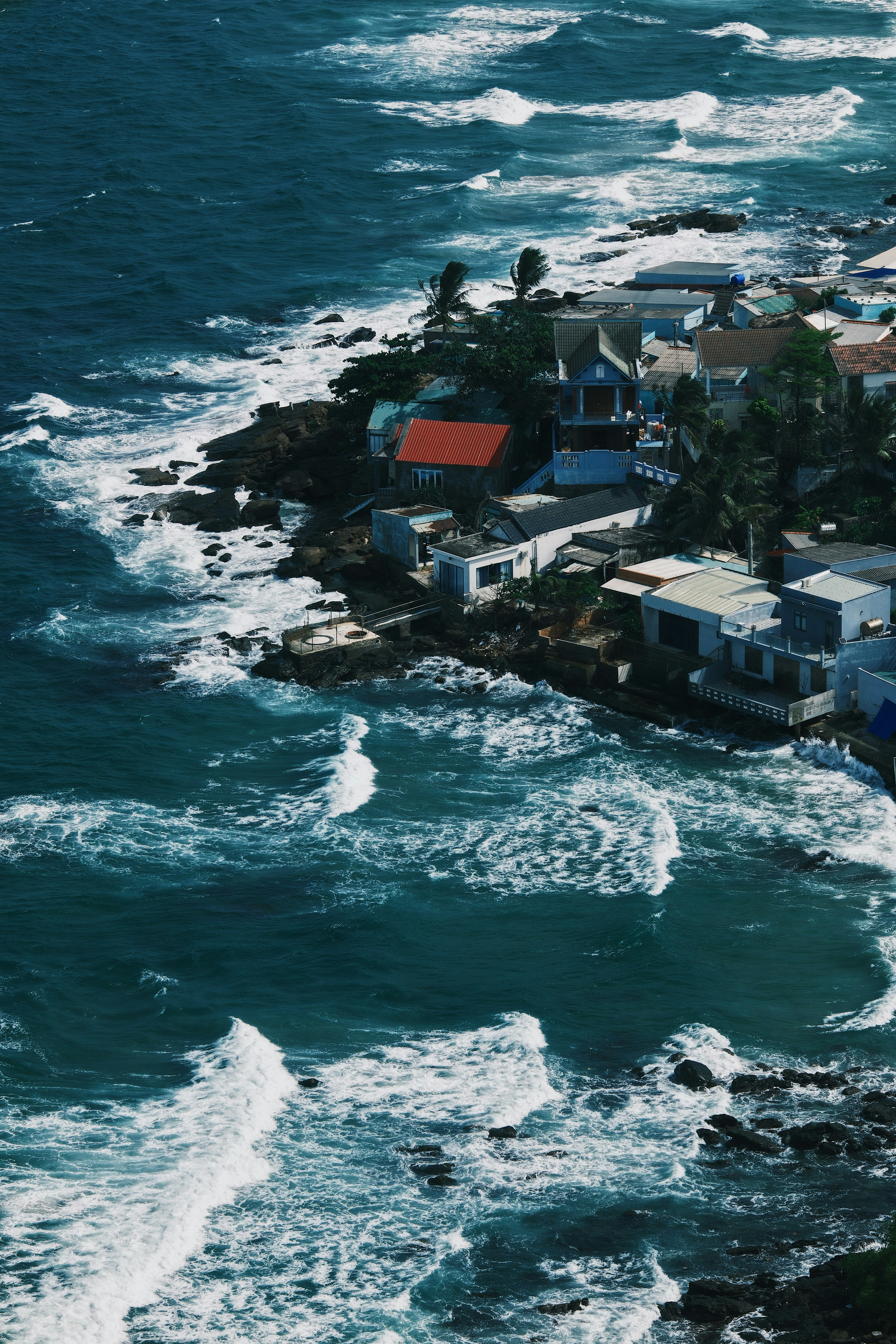 Coastal Village Nestled Along Turquoise Rocks