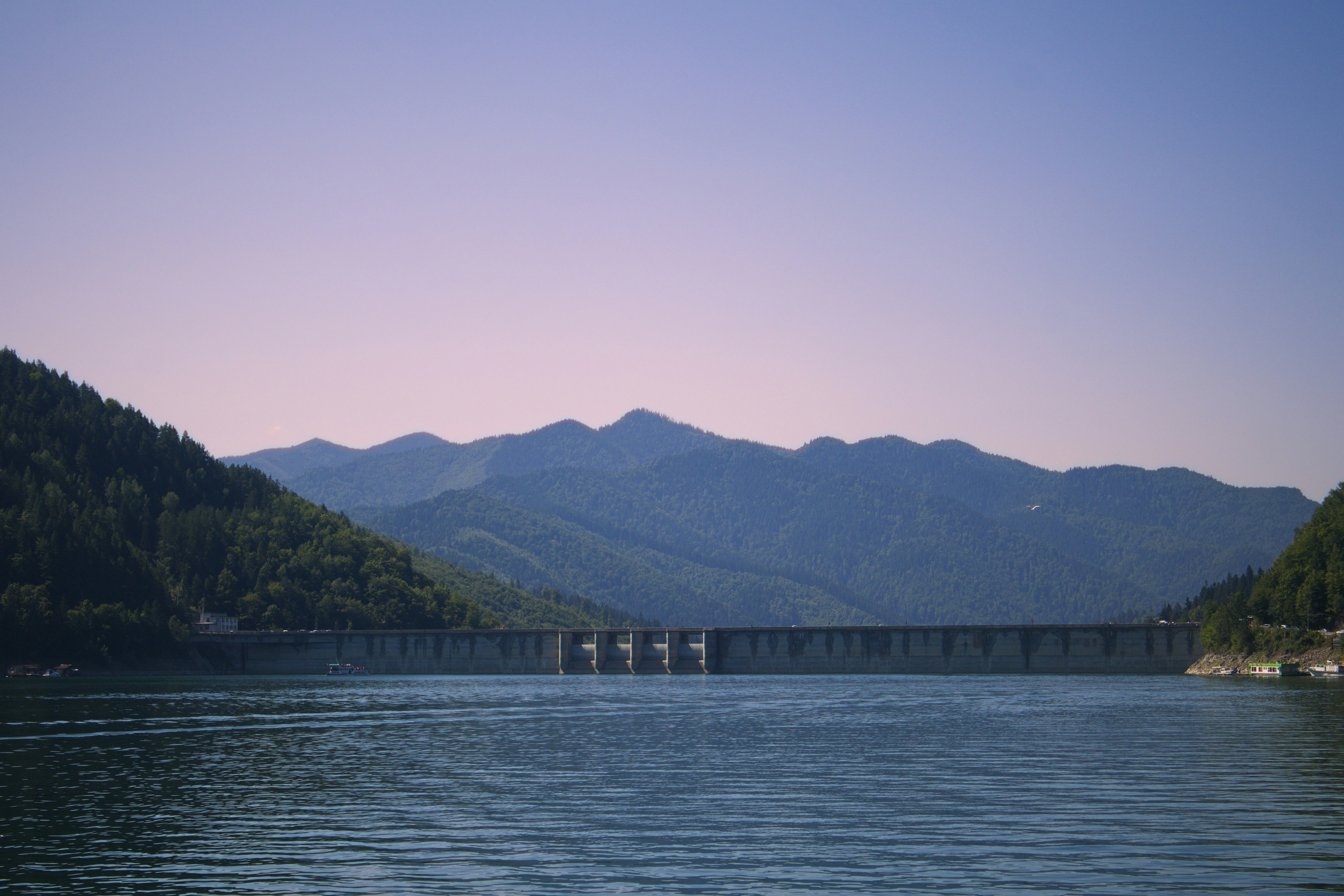 Bridge at Dusk Over a Tranquil Mountain Reservoir