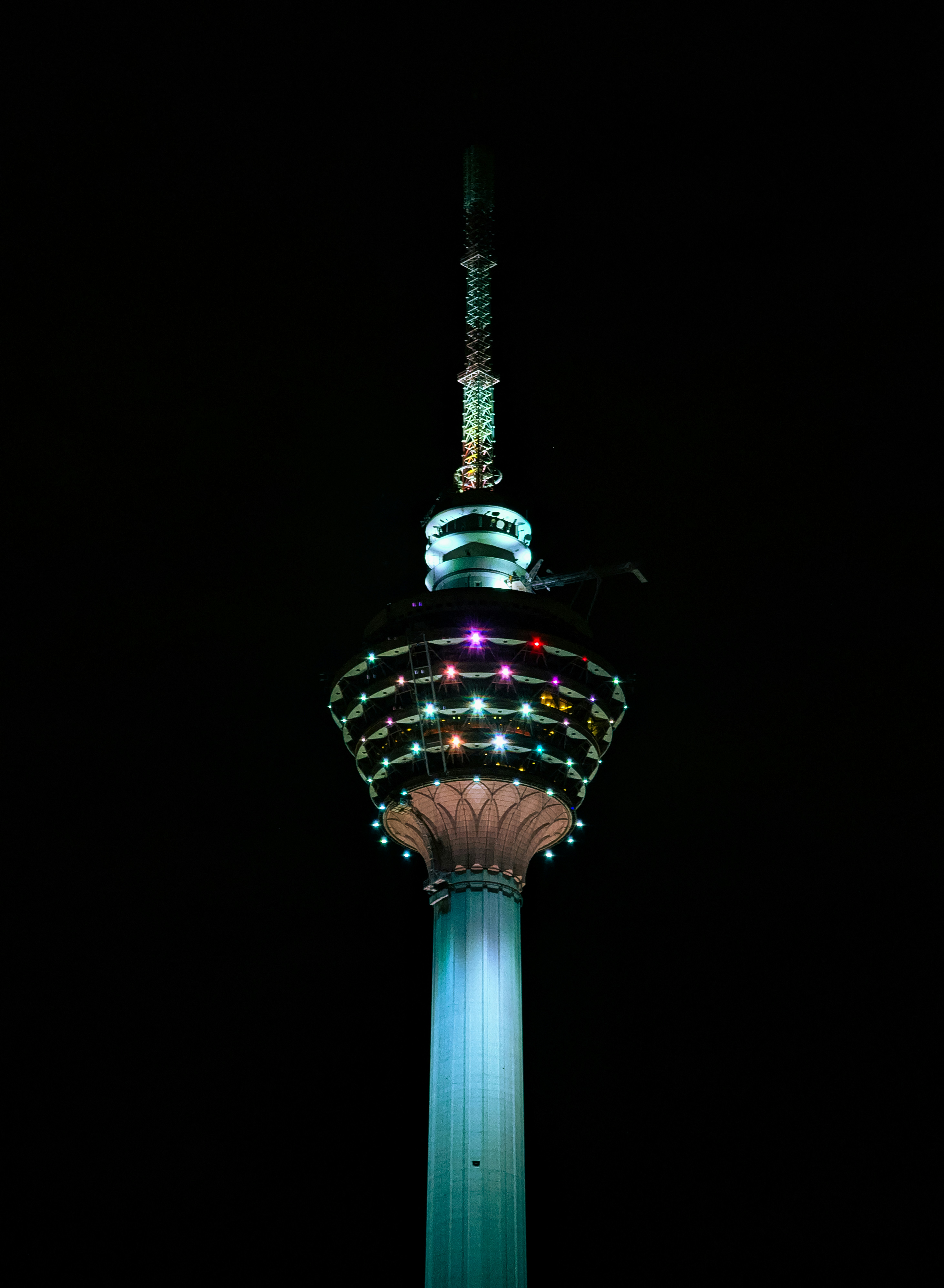 Midnight Beacon: A Neon-Tipped Tower Piercing the Dark