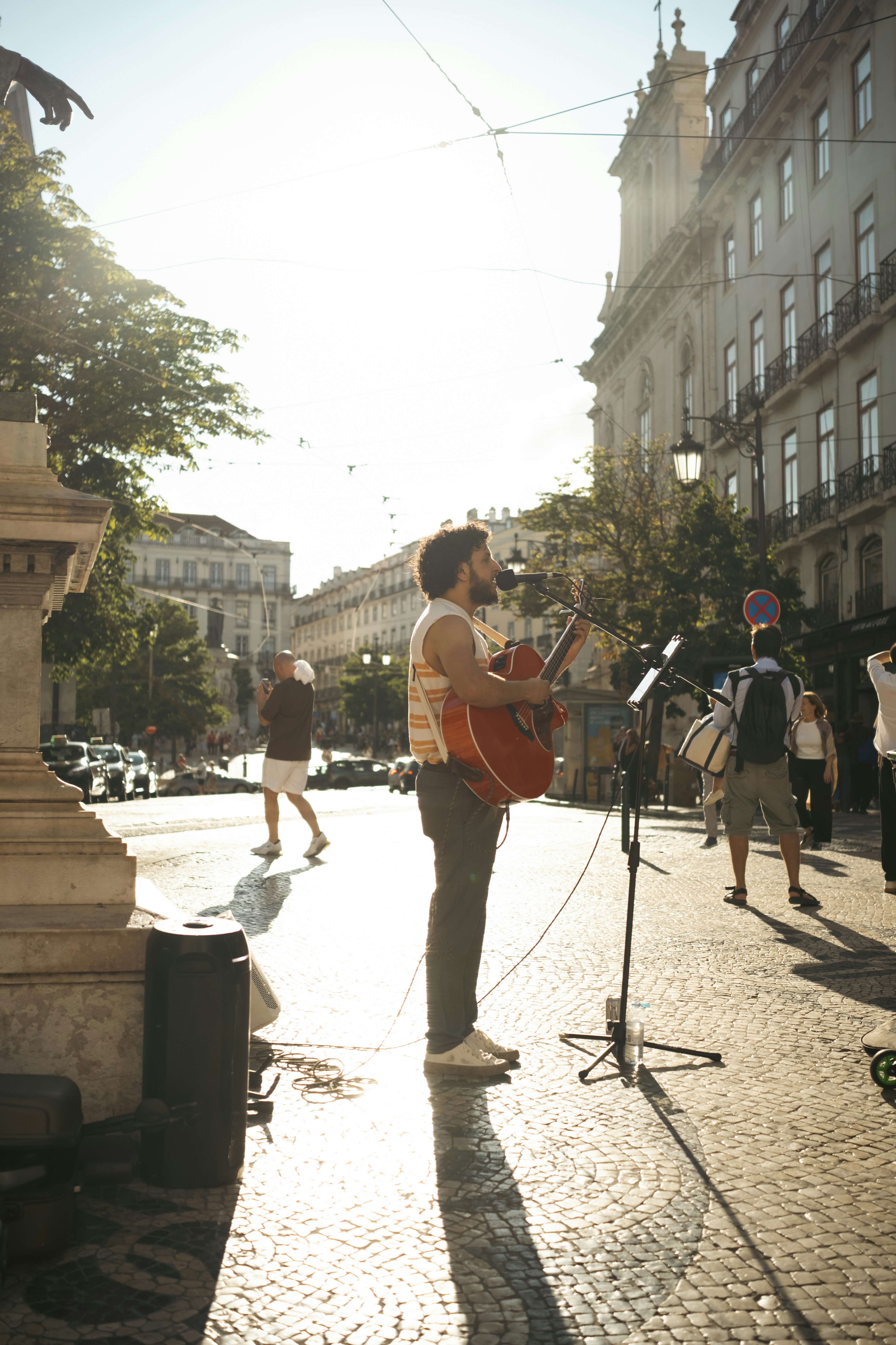 Busker at Golden Hour: Guitarist in a European Street