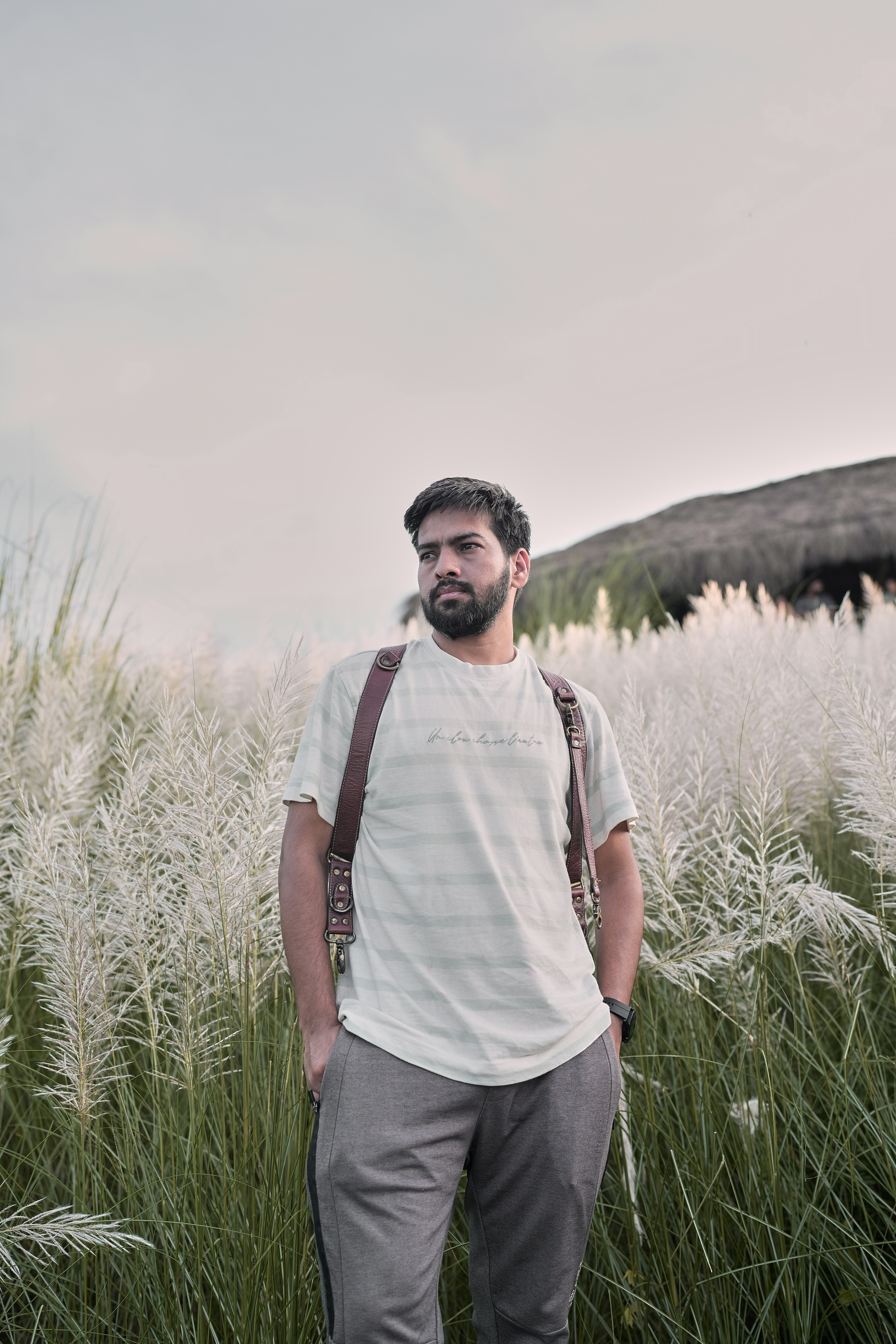 Portrait in Taller Grasses: A Quiet Moment Under Pale Skies