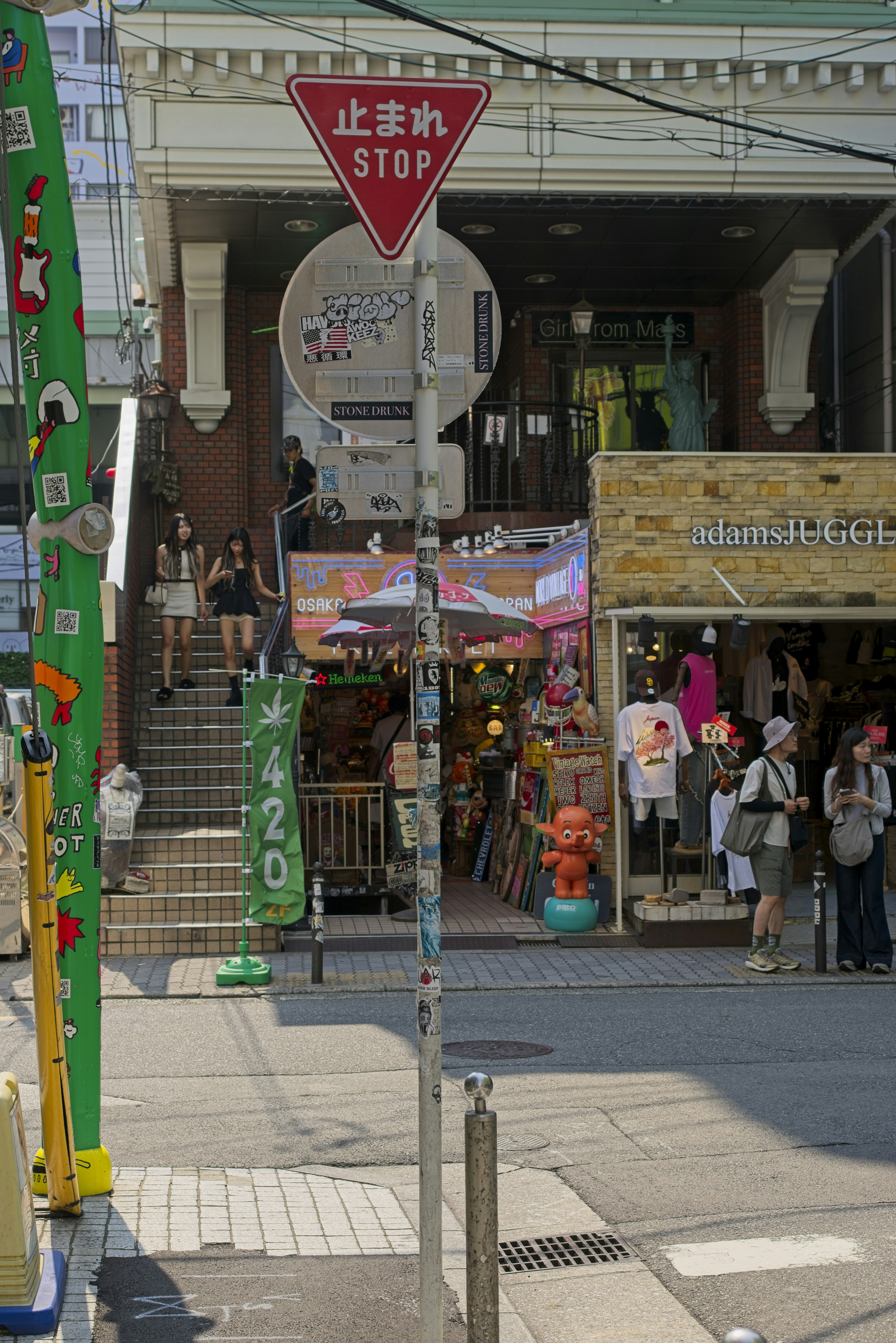 Street Vibe Under a Stop Sign: Markets, Staircases, and Neon Goods