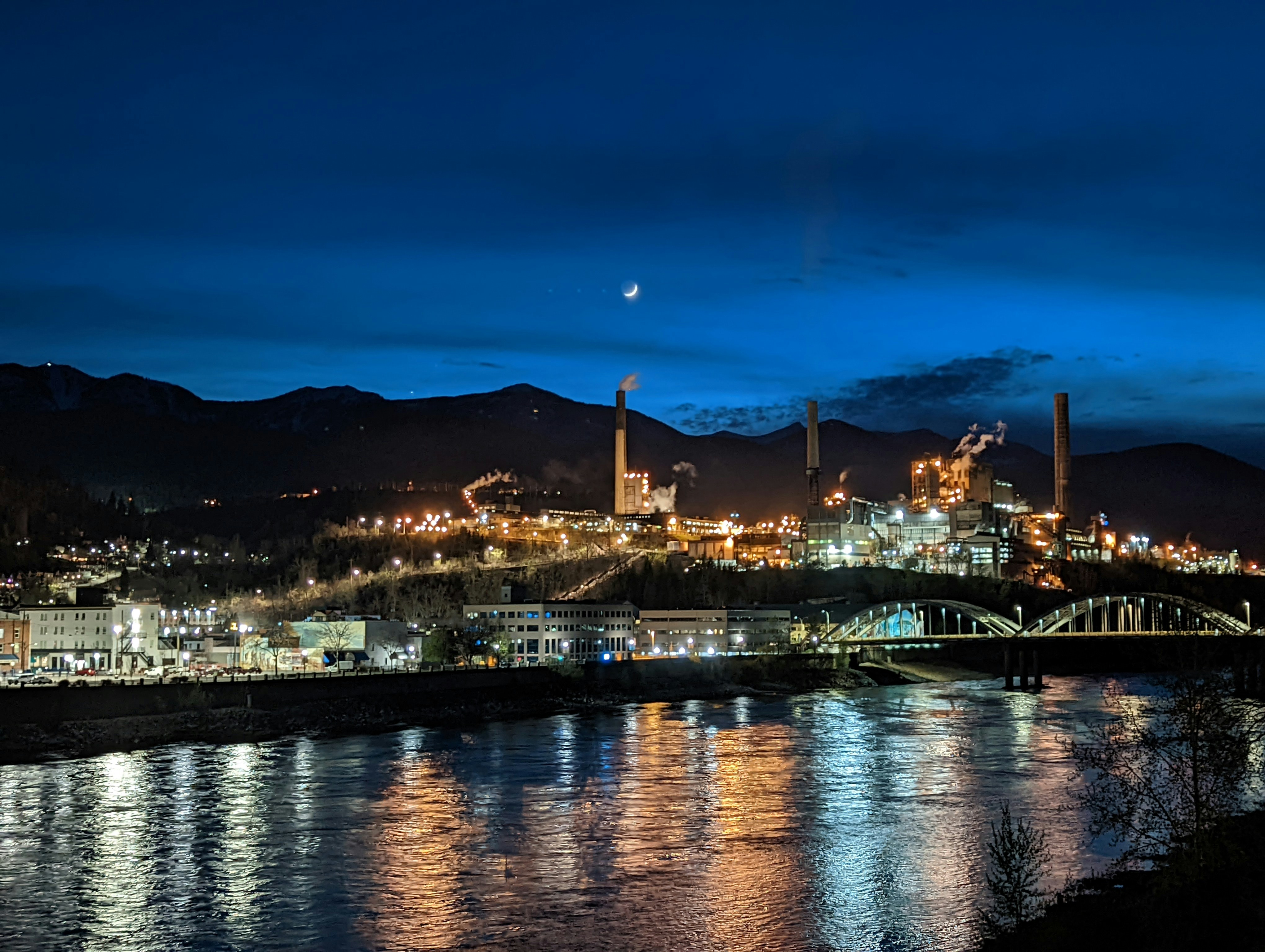 Nighttime Industrial Riverscape Under a Velvet Sky