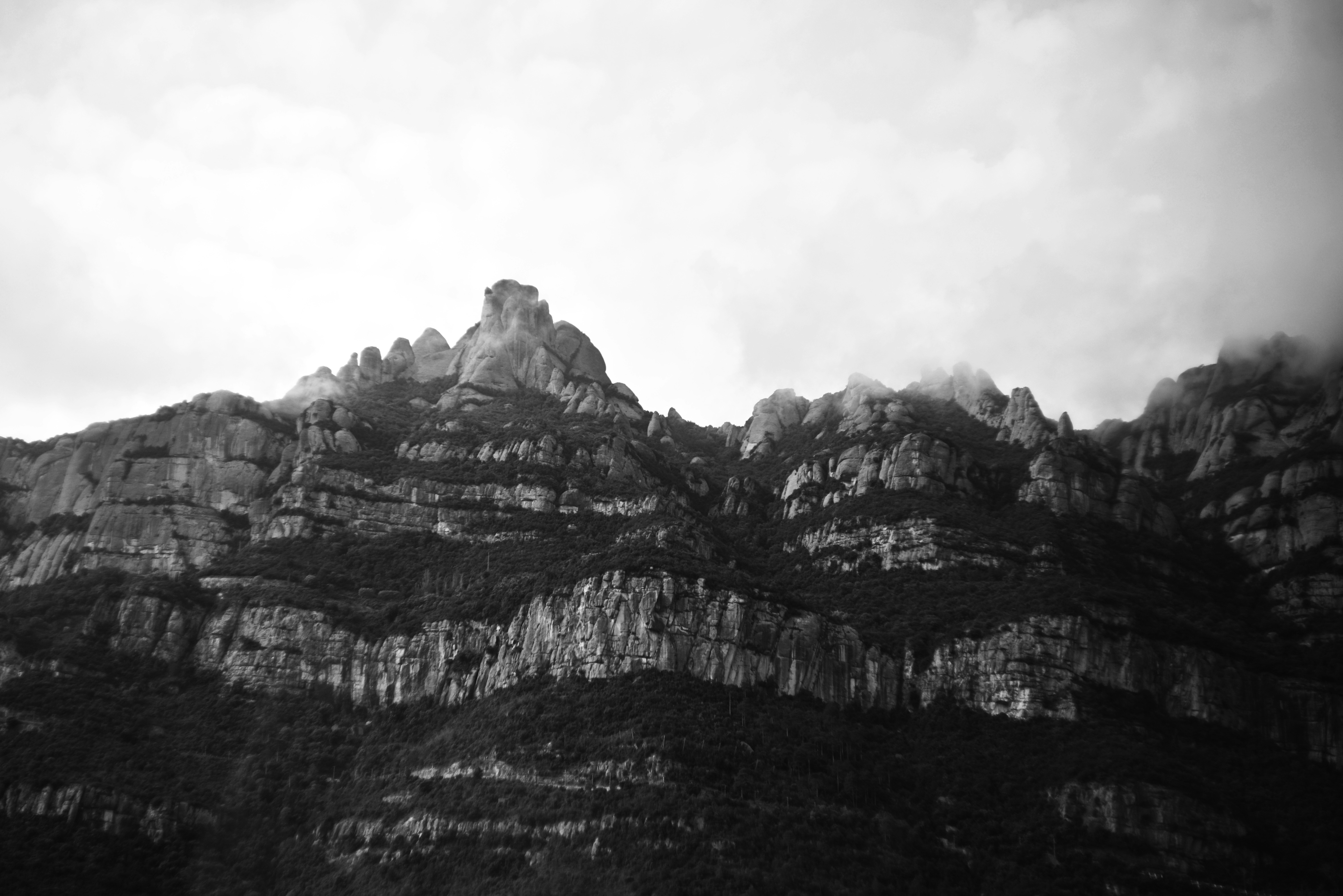 Rugged Peaks Emerging from Mist in Monochrome