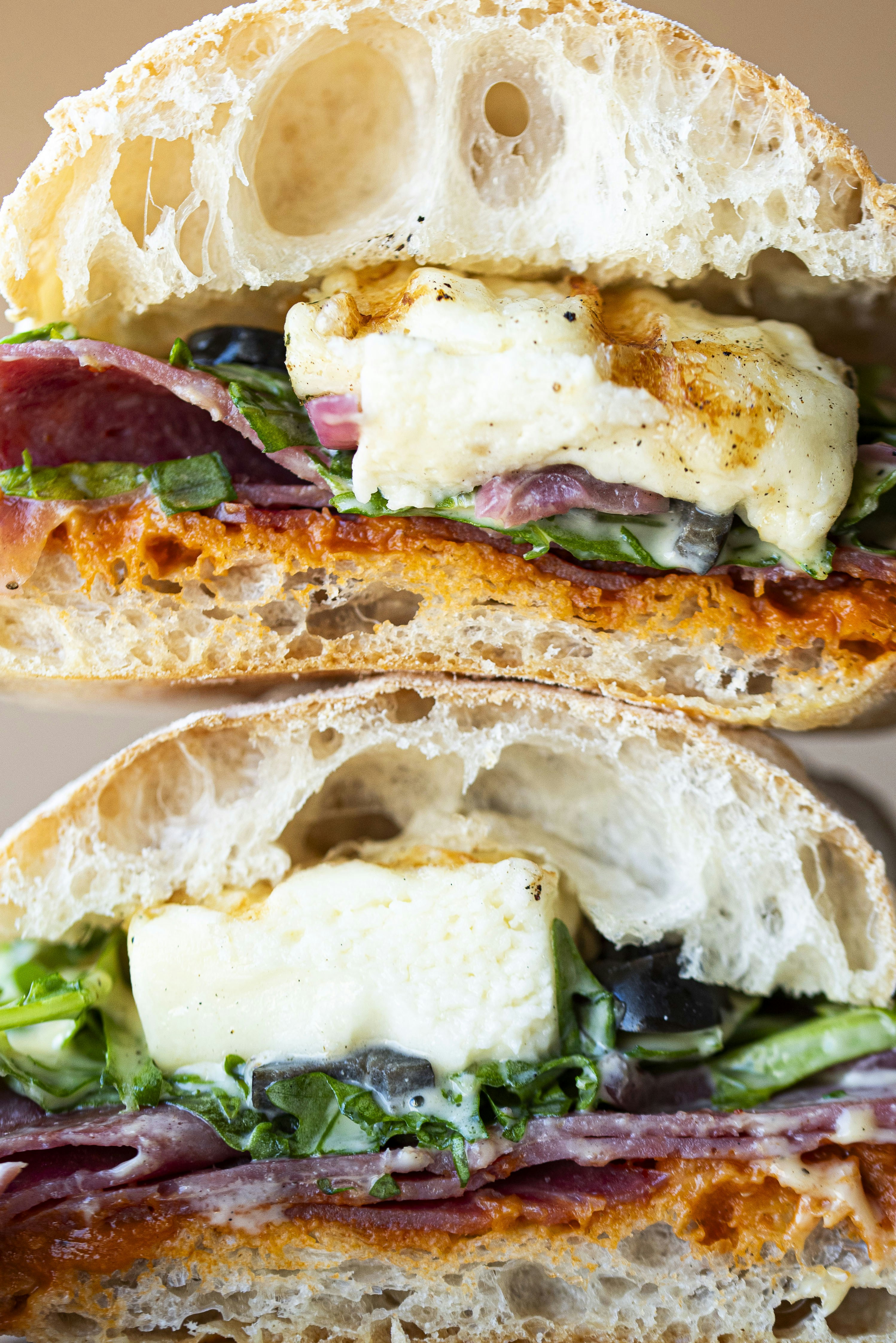 Stacked Sandwich Symphony: Cheese, Greens, and Crunch