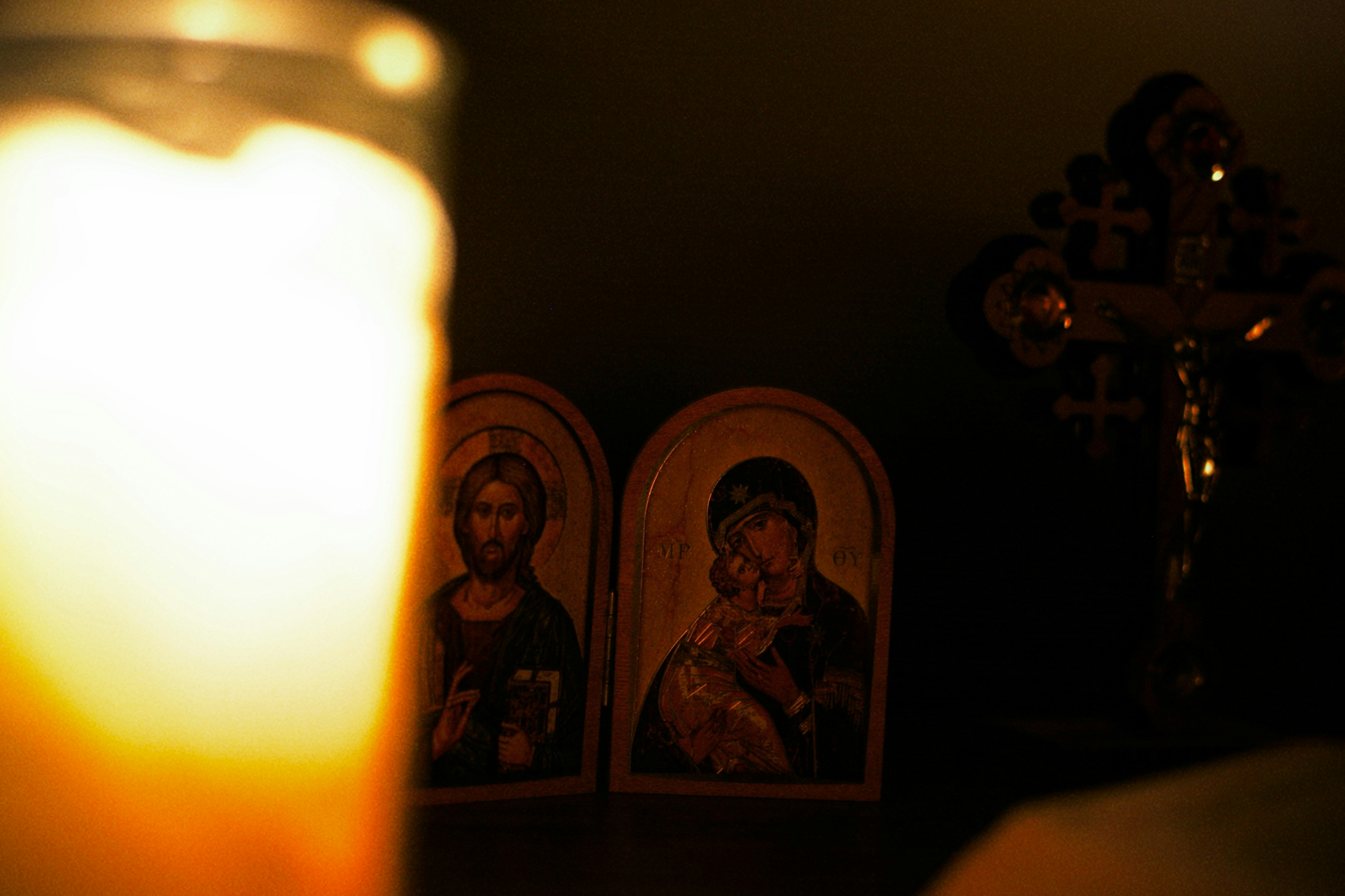 Dim Shrine: Illuminated Icons in a Quiet Corner