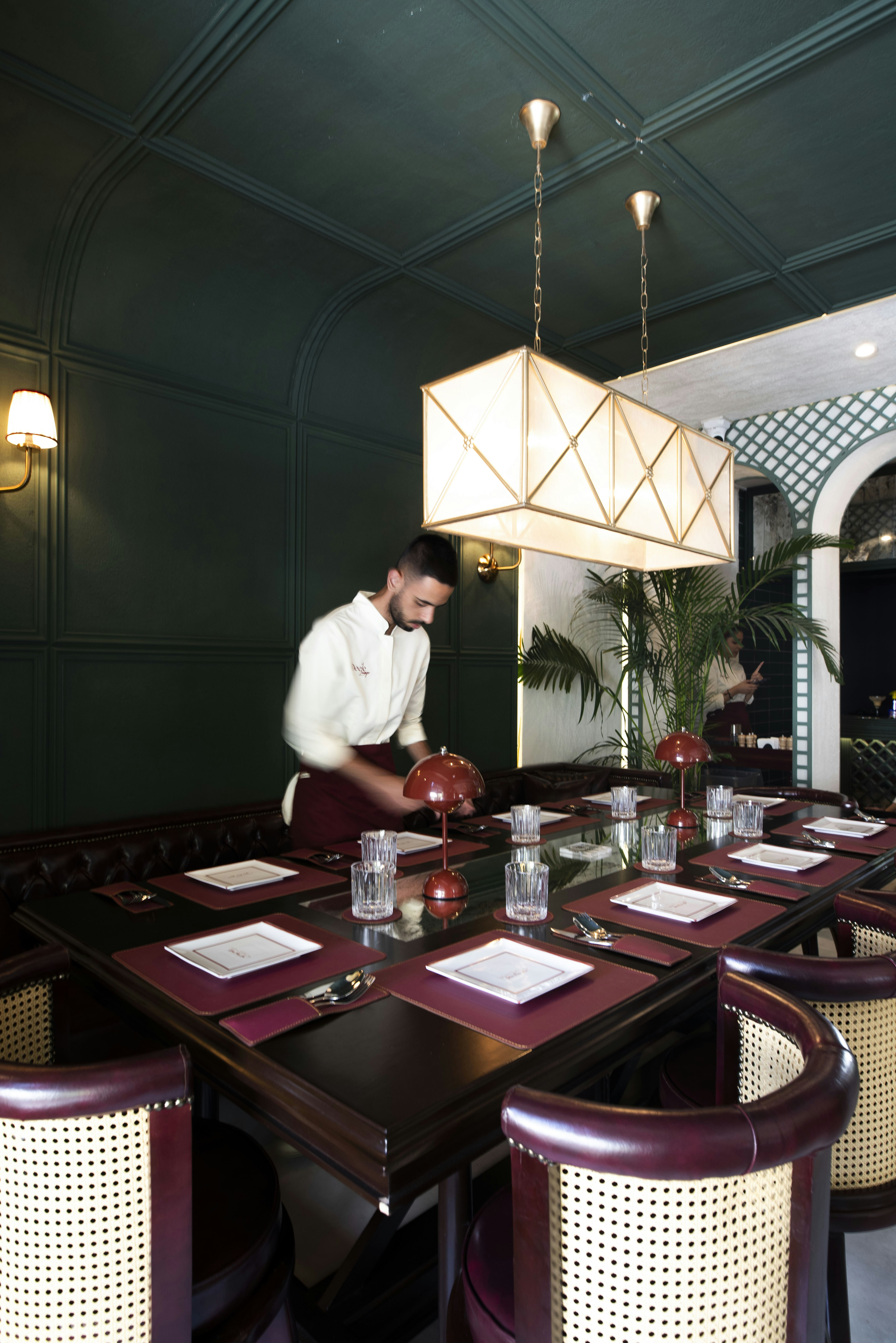 Ambient Dining: A Chef at Work Under a Geometric Pendant Light