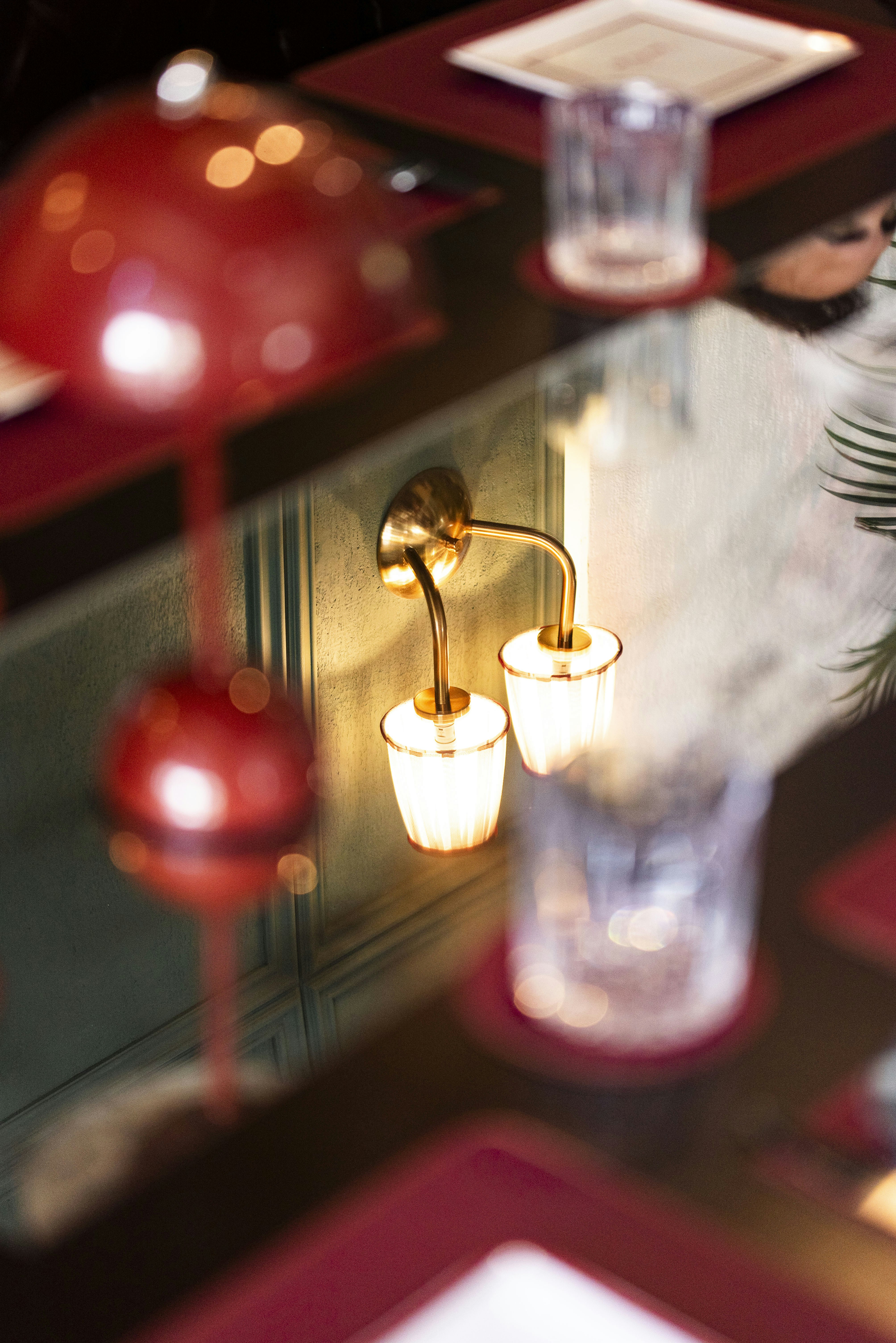 Soft Glimmer: Half-Blurred Glasses Illuminate a Vignette of Dinner