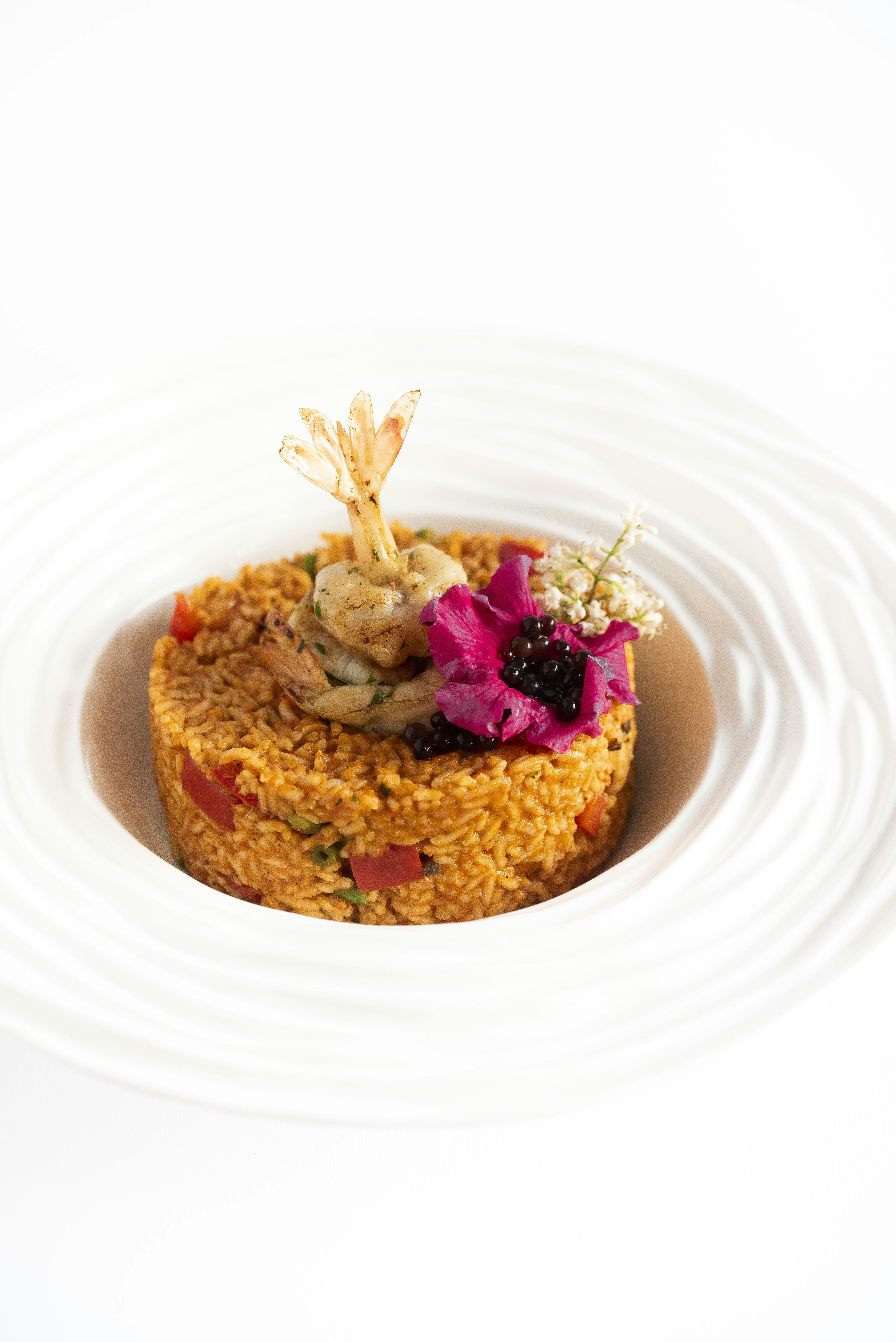 Crispy Rice Crown: A Gourmet Ring of Flavor with Orchid Garnish