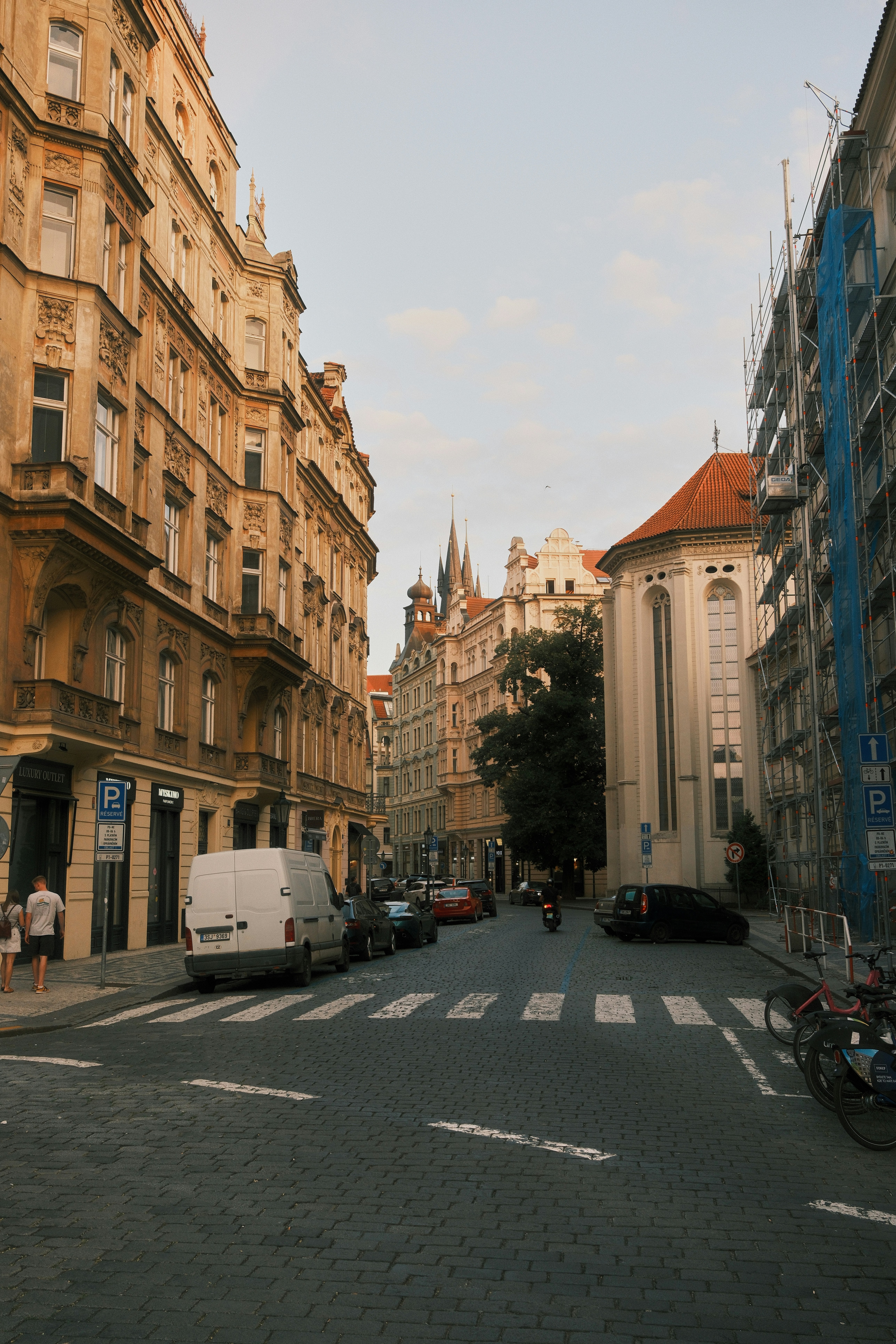 Cobbled City Stroll Under Pale Evening Sky