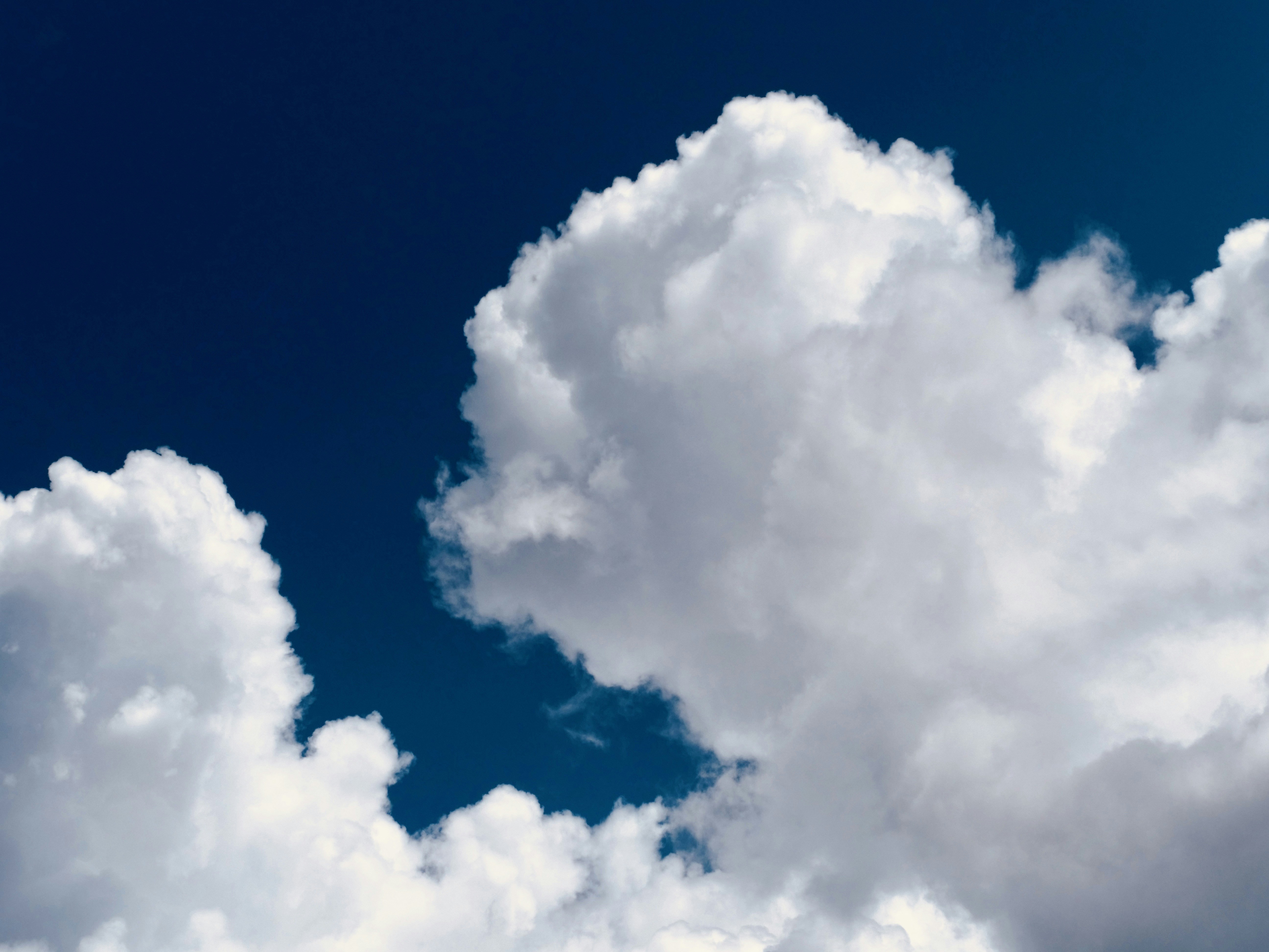 Cloud Giants Over a Deep Blue Sky