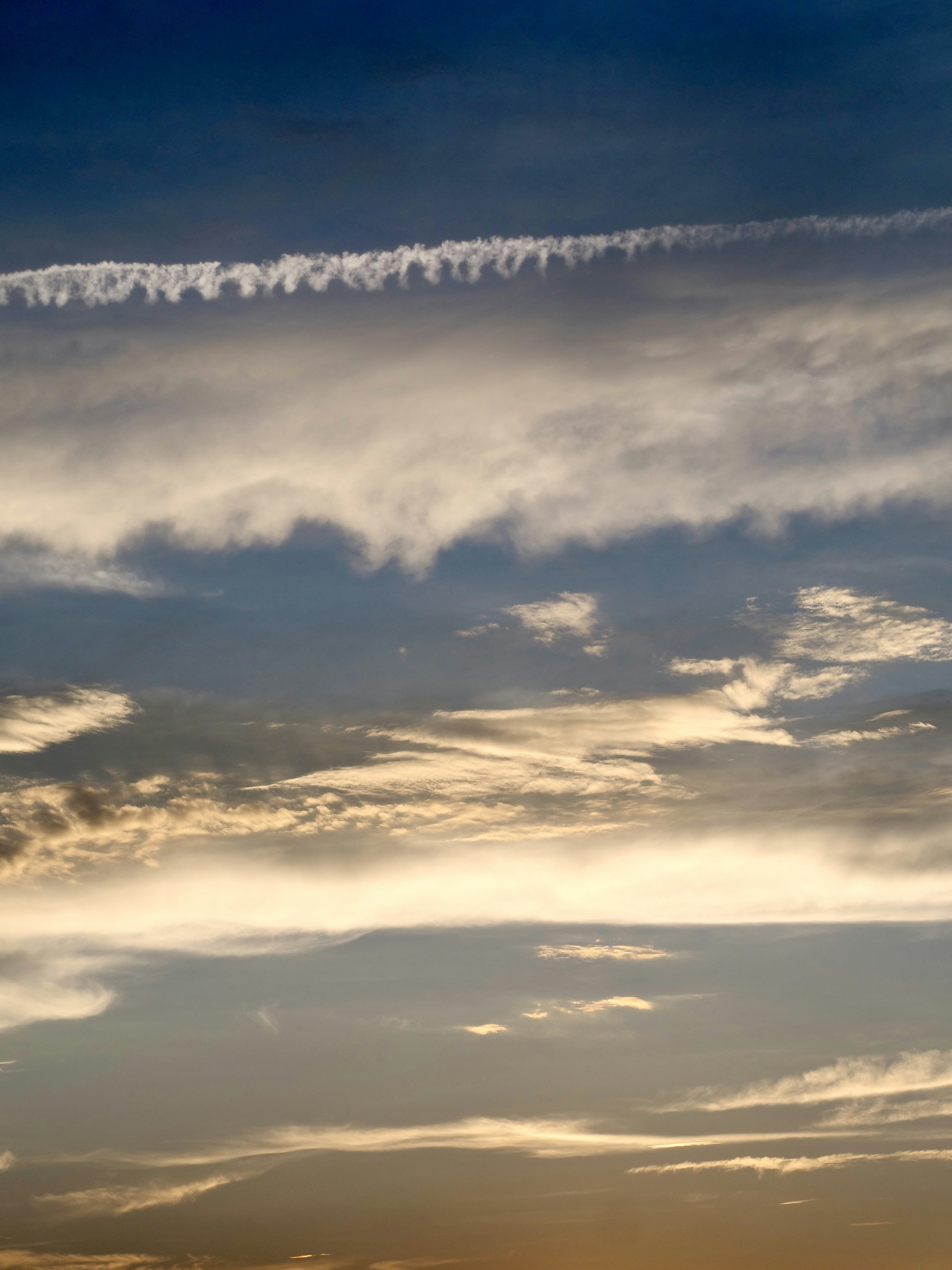 Vast Sky Ledger: Layered Clouds at Sundown