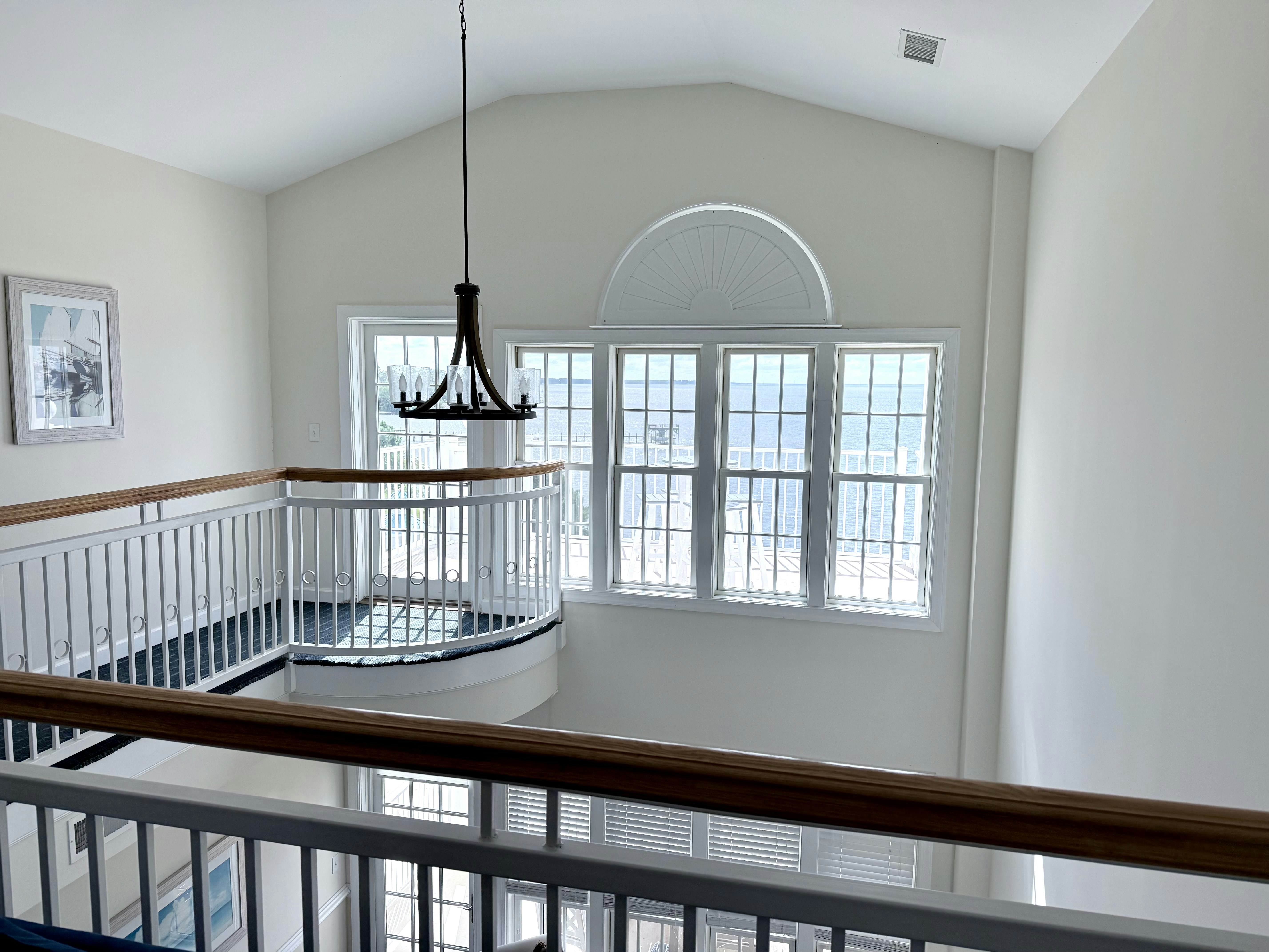 Sunlit Staircase Atrium with Central Window Bloom