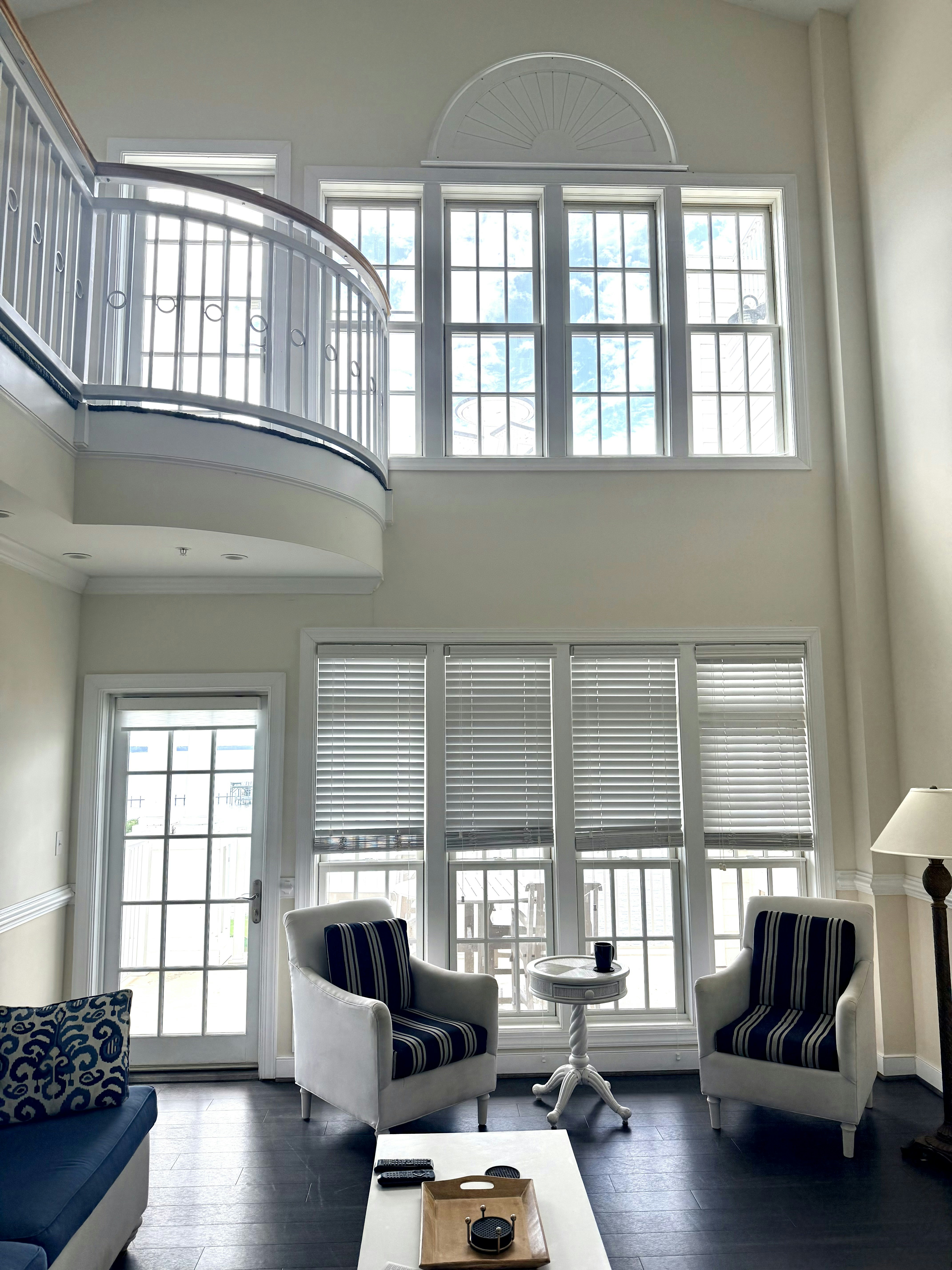 Sunlit Conservatory Living Room with Balcony Curves