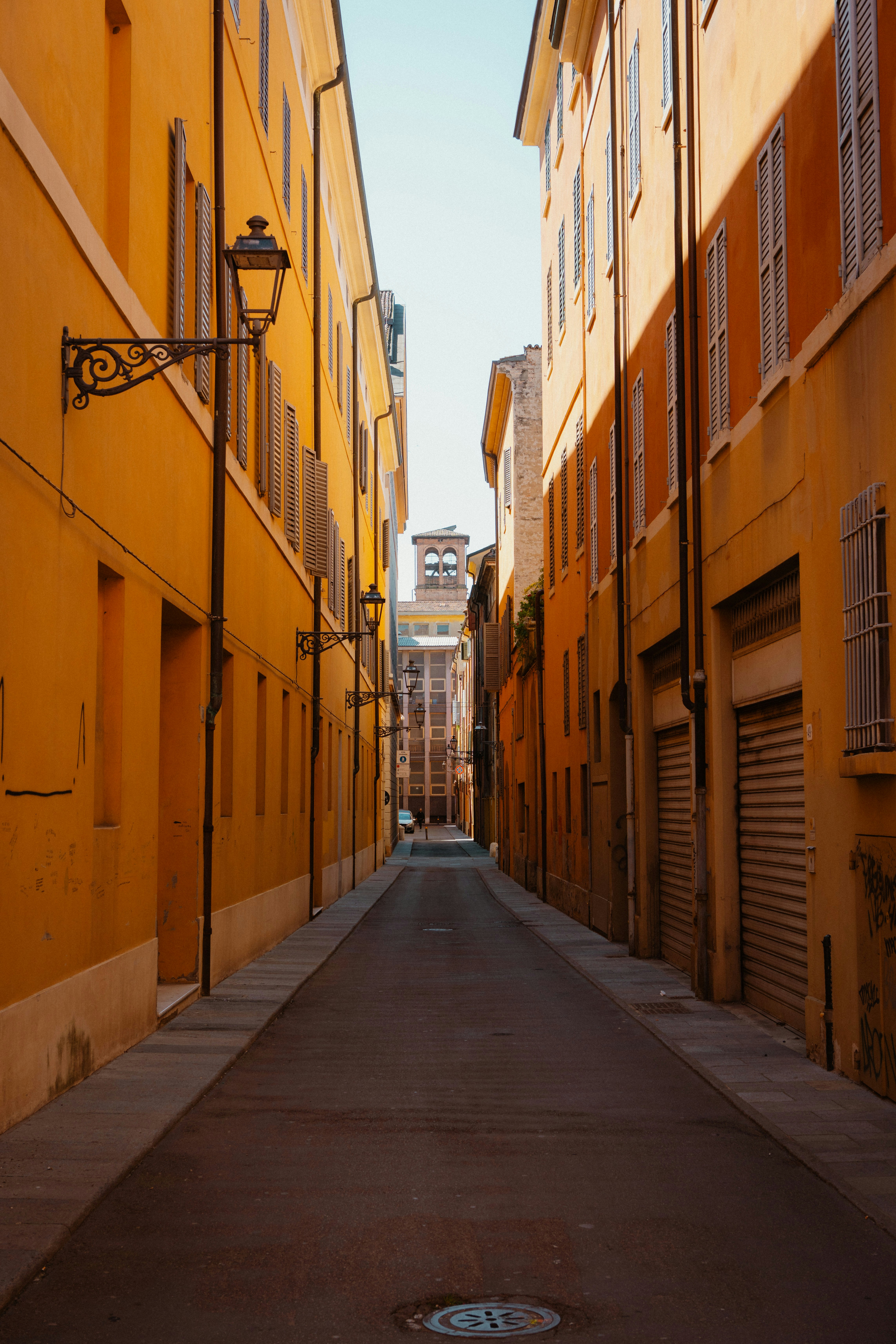 Sunlit Calle of Sienna: A Narrow Corridor to the City’s Heart