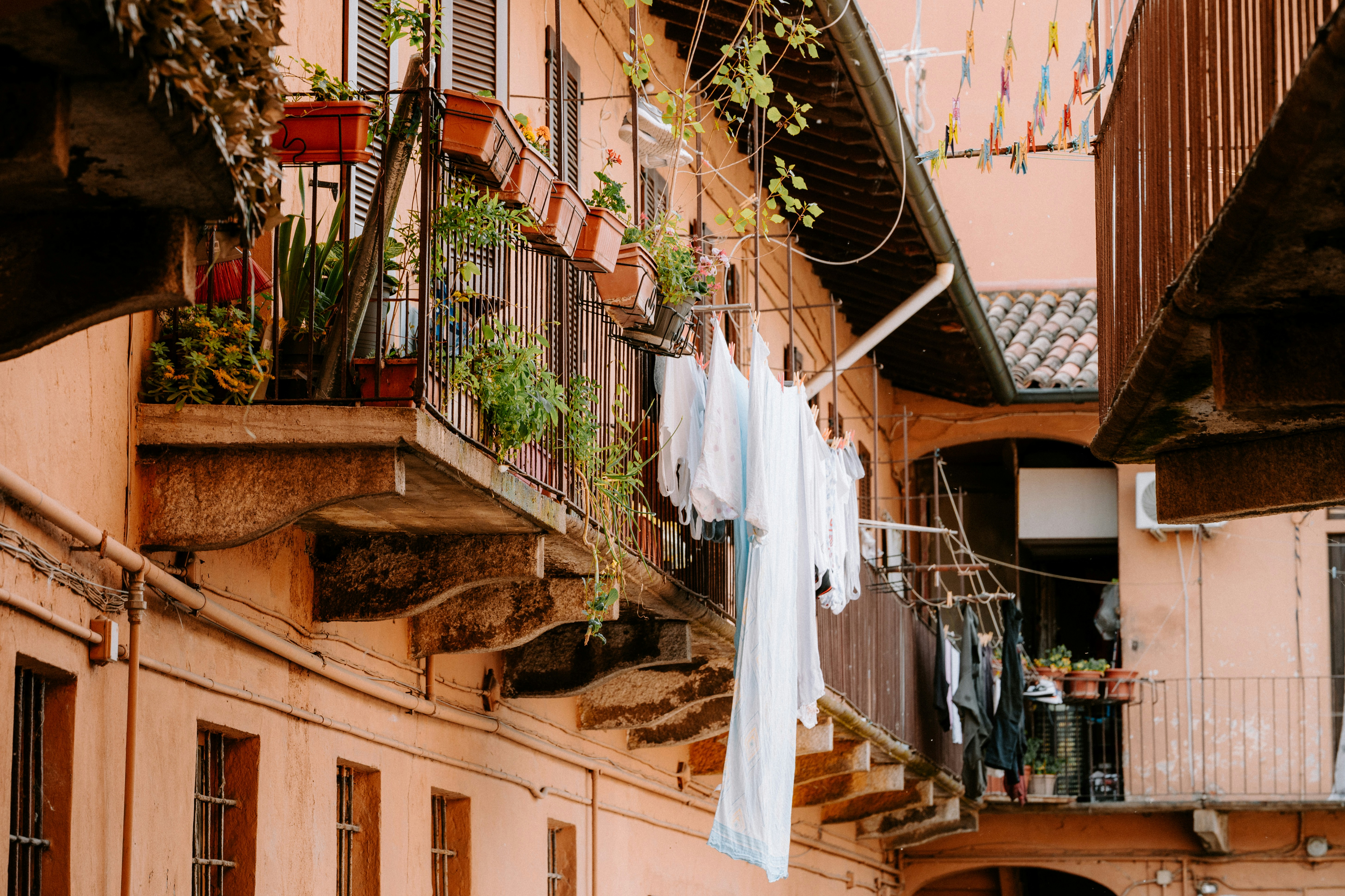 Laundry Lines and Painted Balconies: A Sunlit Calle of Living Color