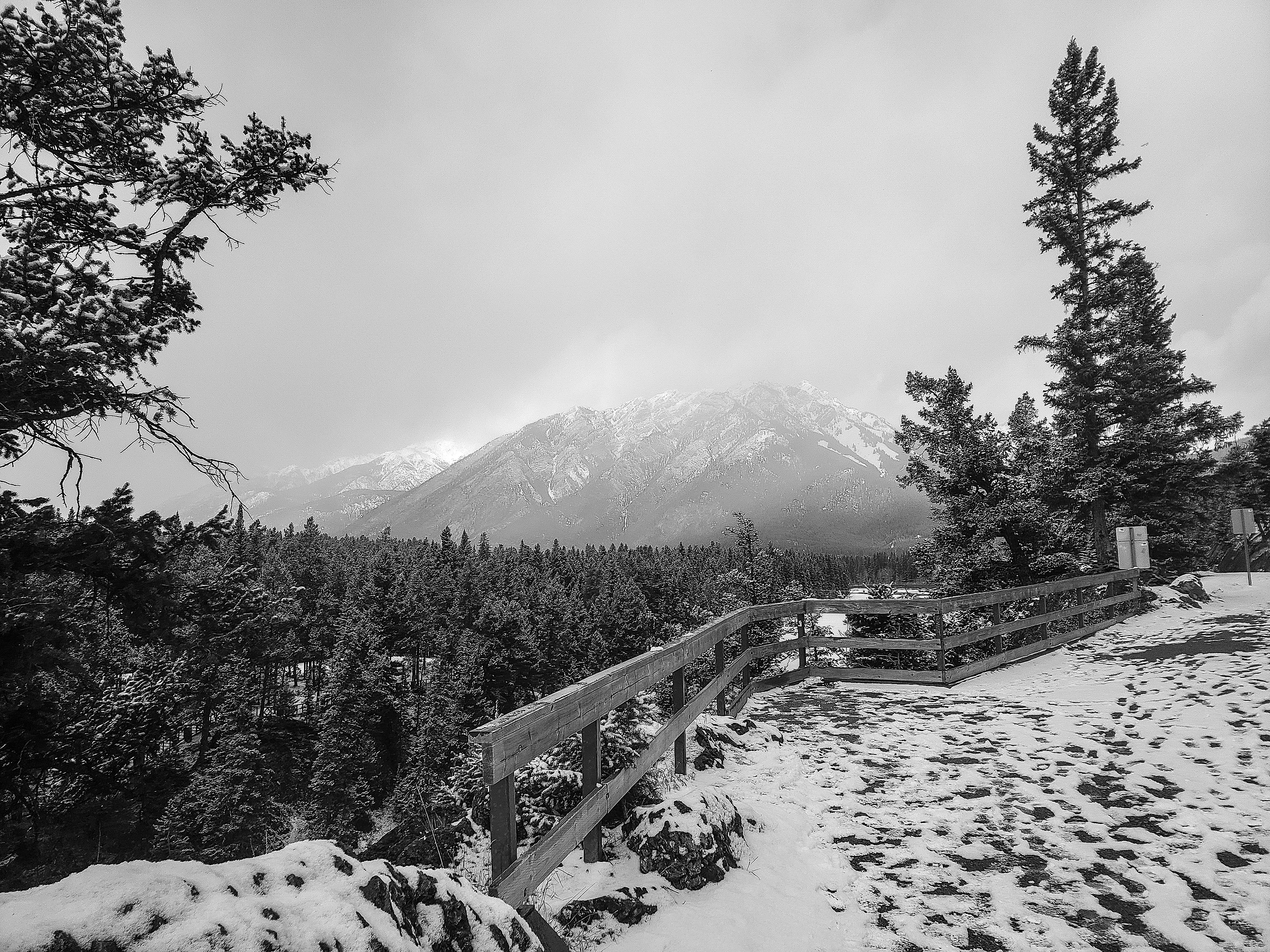 Snowbound Overlook: Mountain Ridge from a Icy Trail