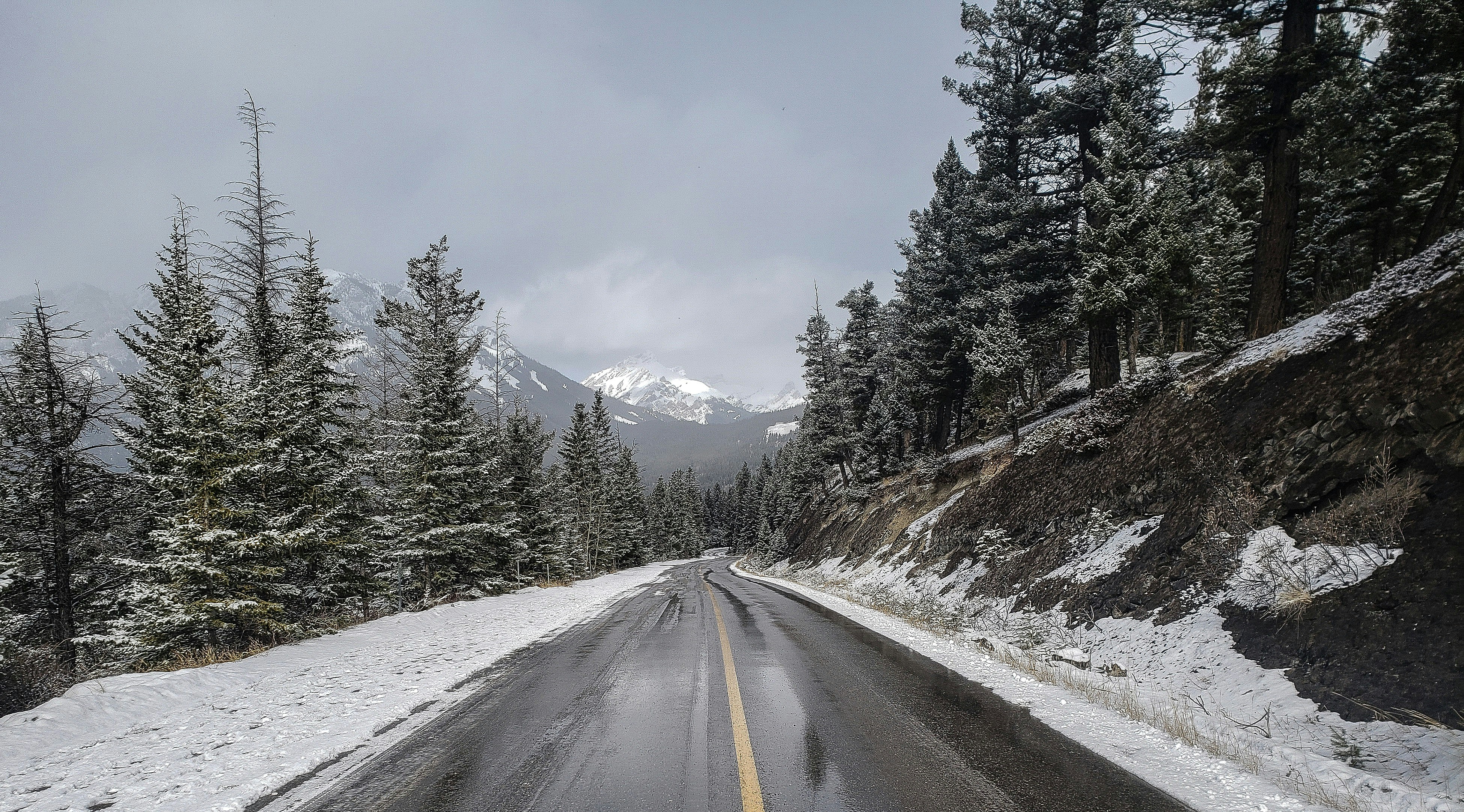 Snowbound Ribbon: A Quiet Mountain Pass Unfolding Ahead