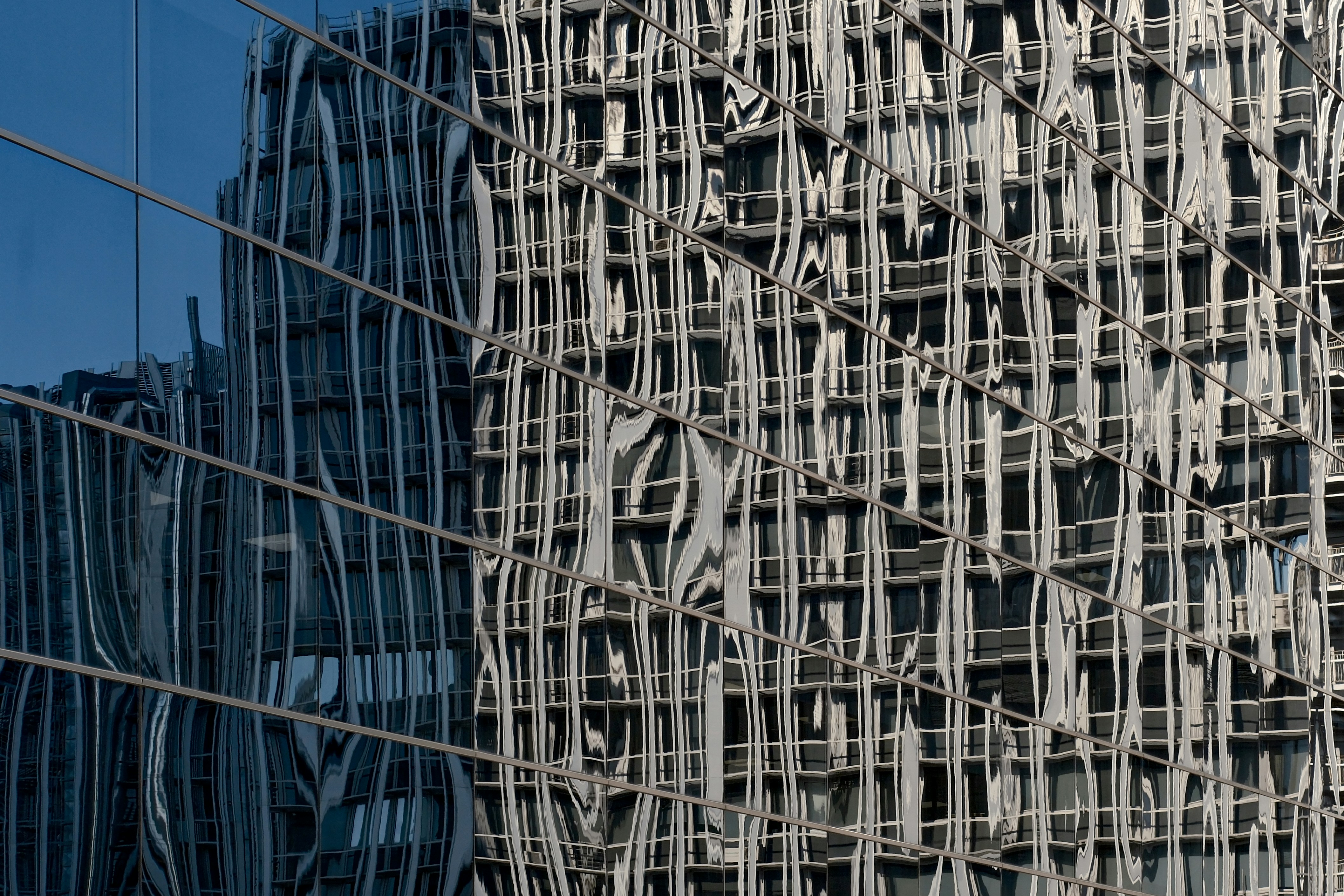 Glass Facade Reflections: A Tangle of Building Grids
