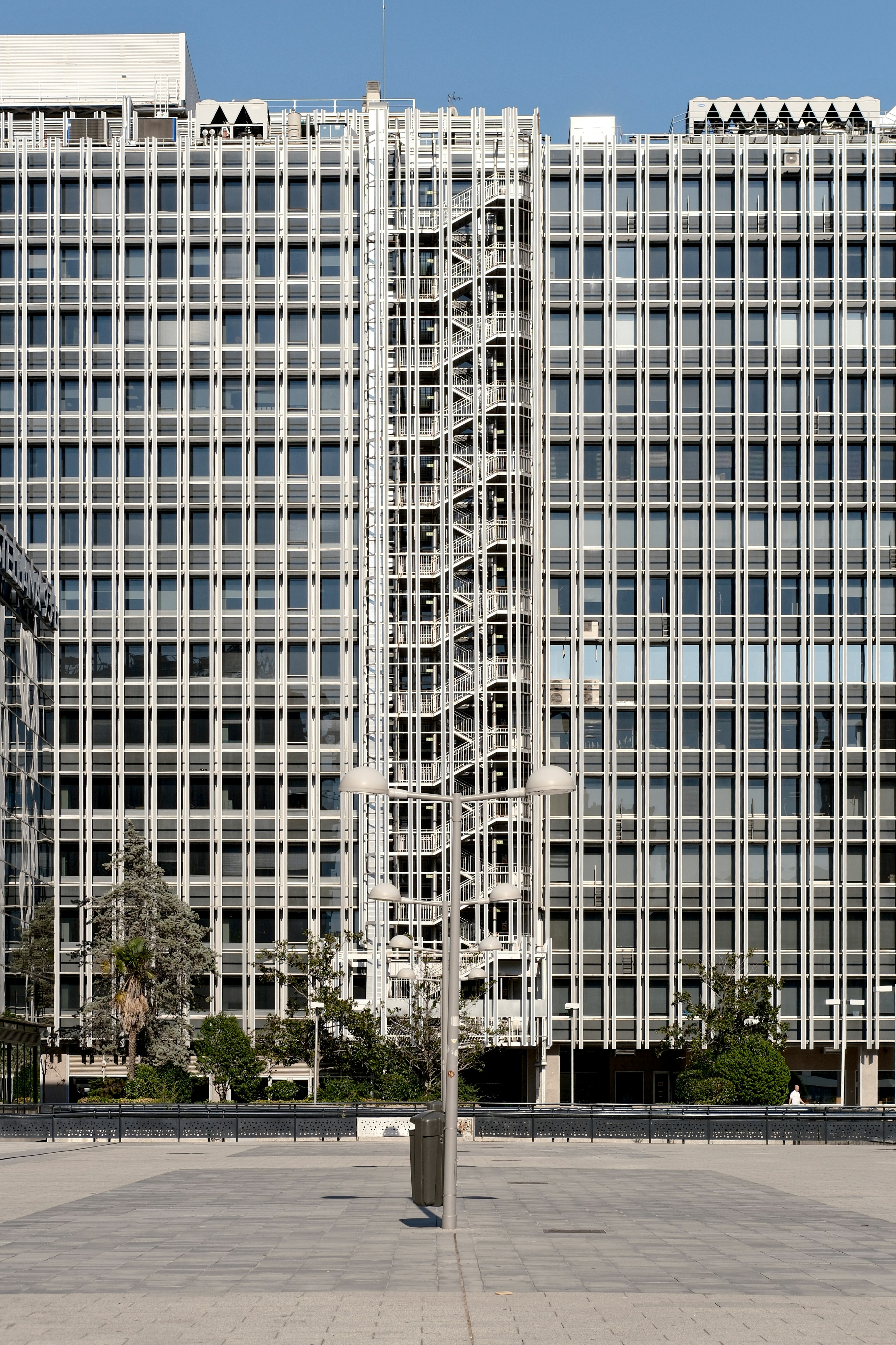 Symmetrical Facade, Central Stairwell Framed by Urban Plaza