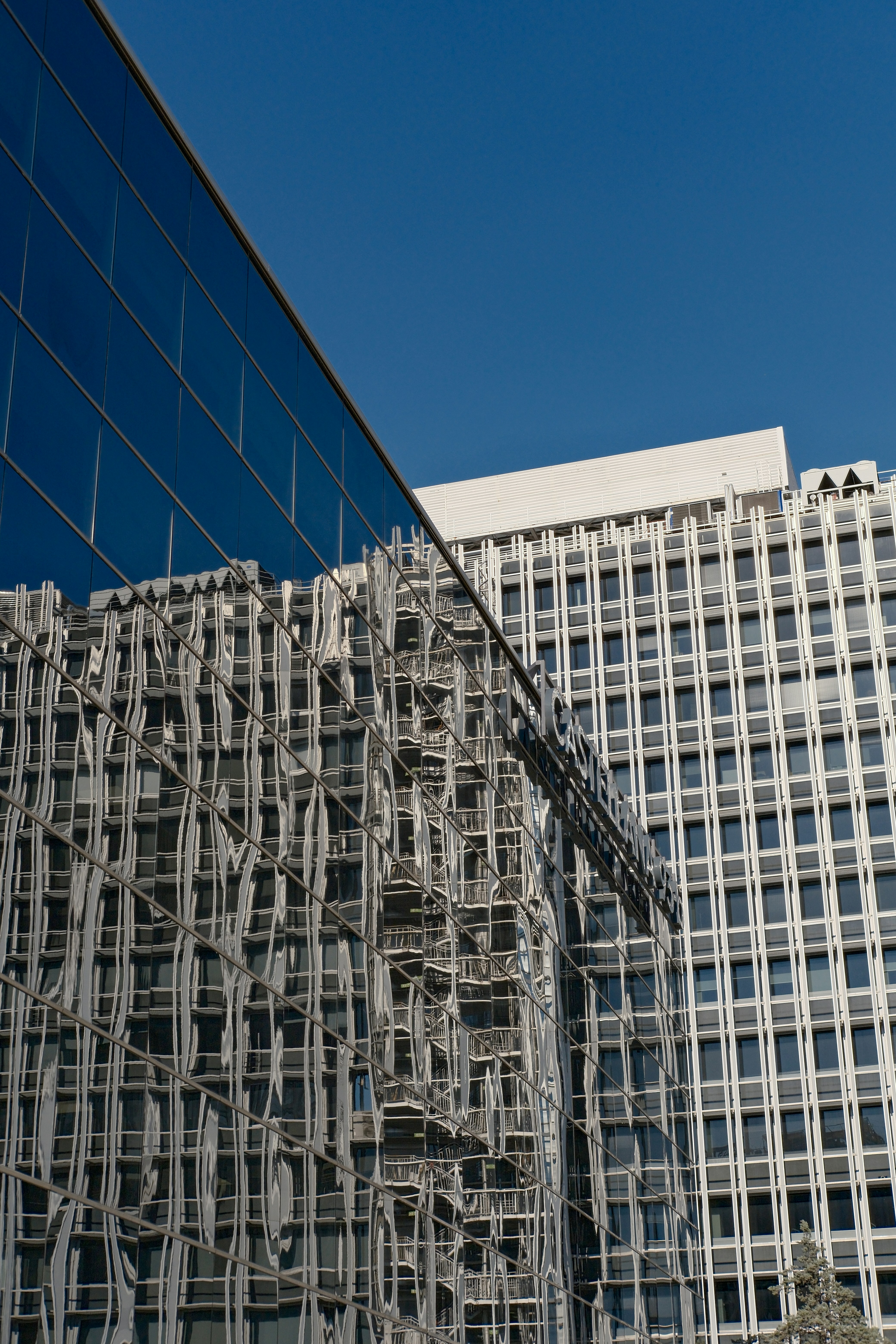 Angular Facade Reflections Against a Clear Sky