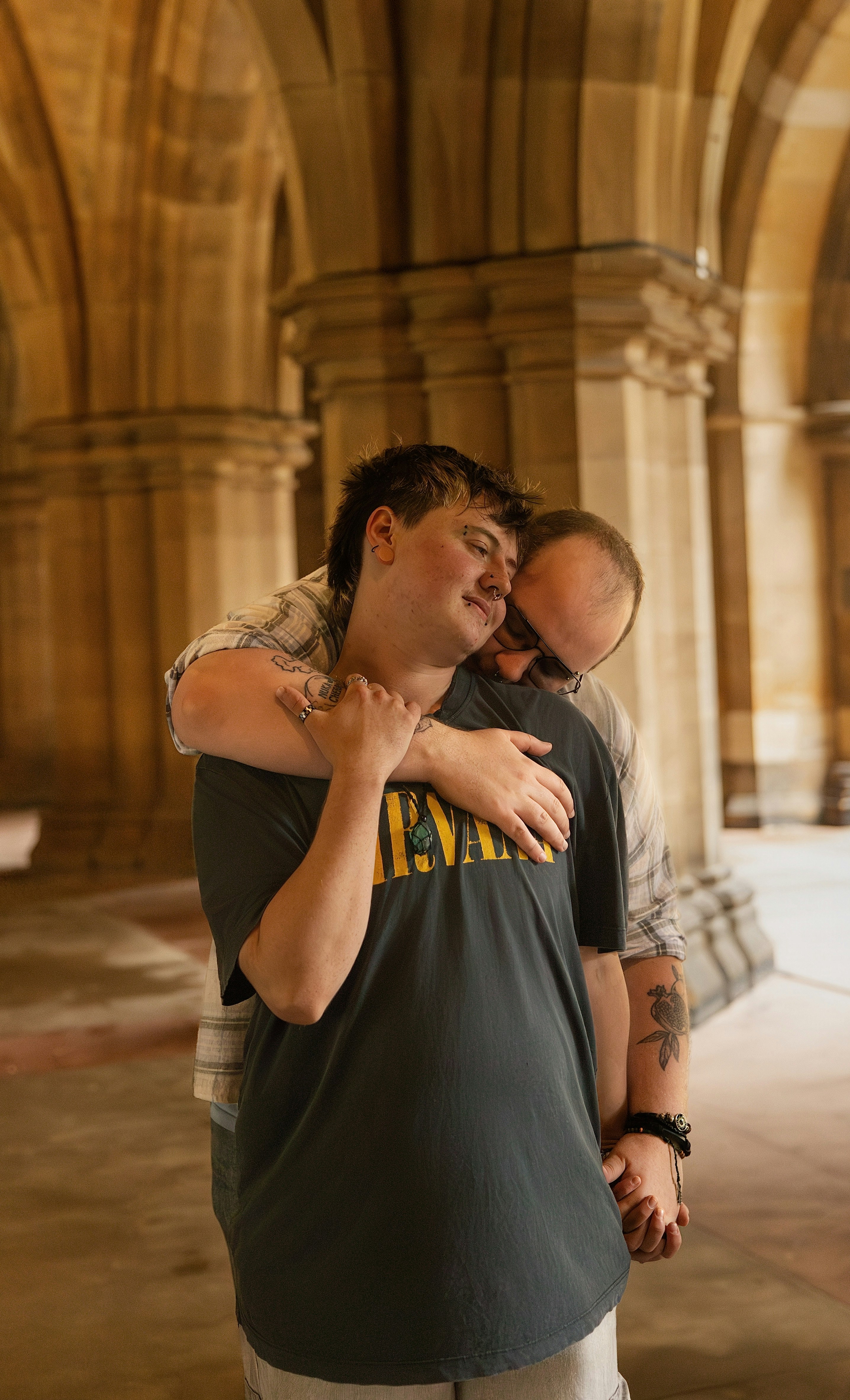 Sandstone embrace beneath arched corridors