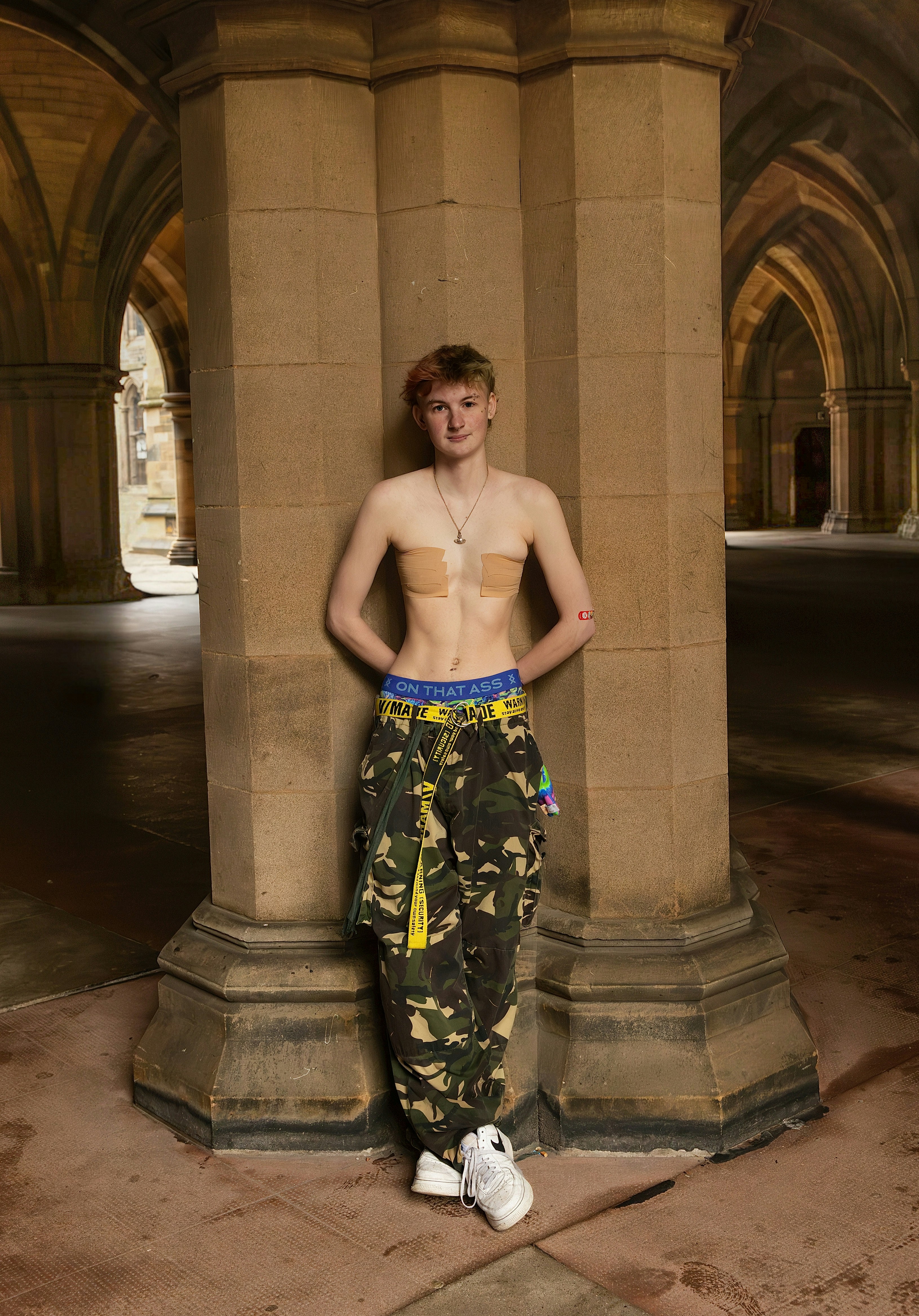 Cipher in Stone: Portrait of defiant calm against cathedral arches