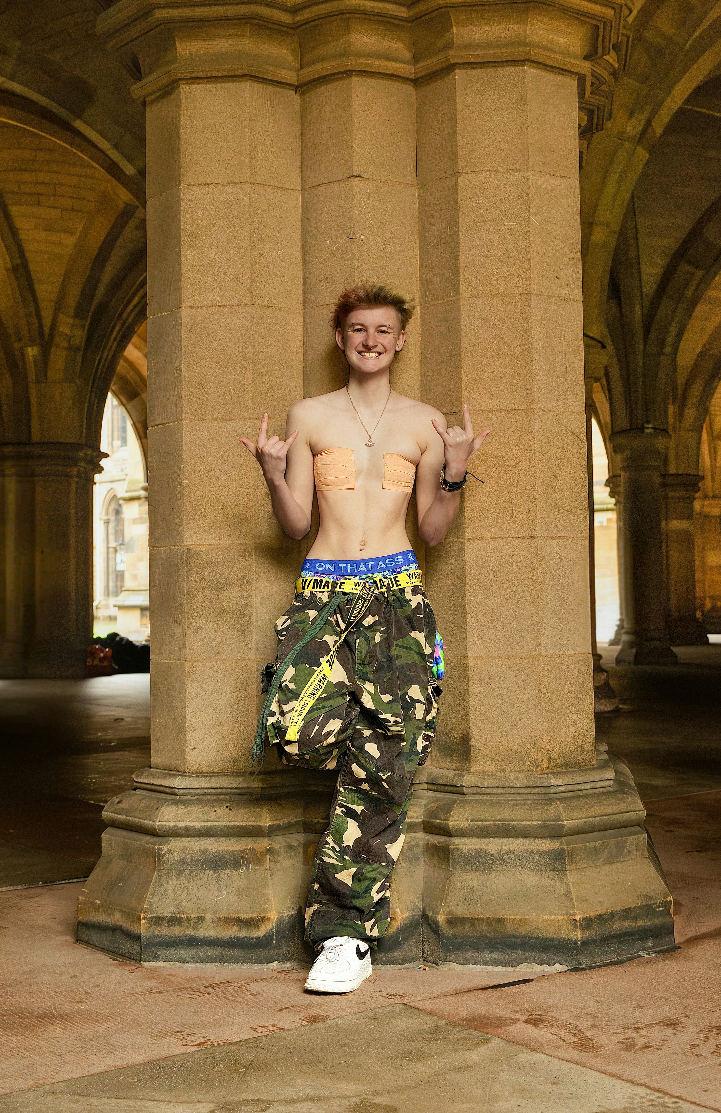 Centered Confidence: Youthful Character Posed Between Cathedral Columns